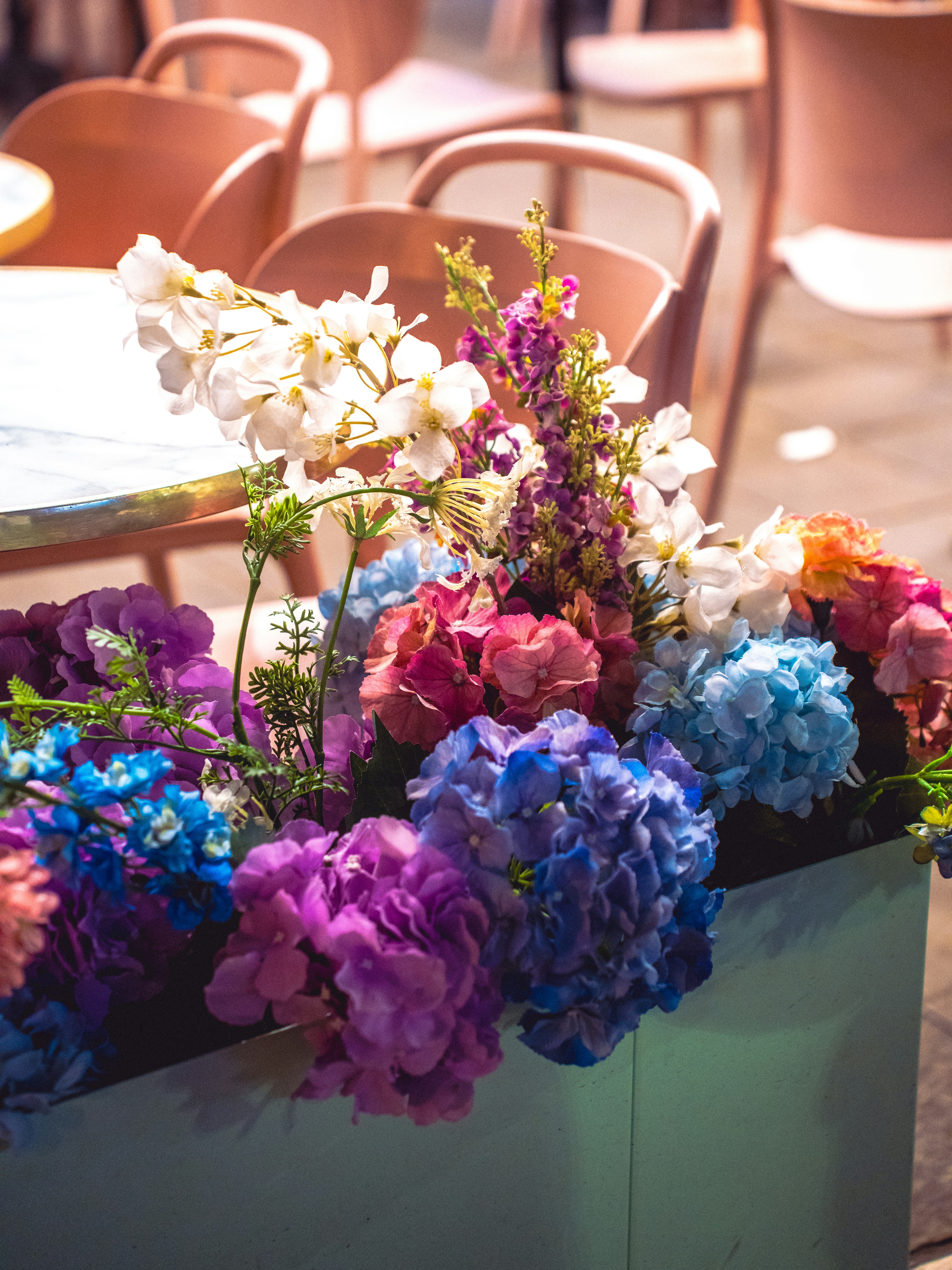 Bouquet of Neon Hydrangea by a Quiet Café Corner
