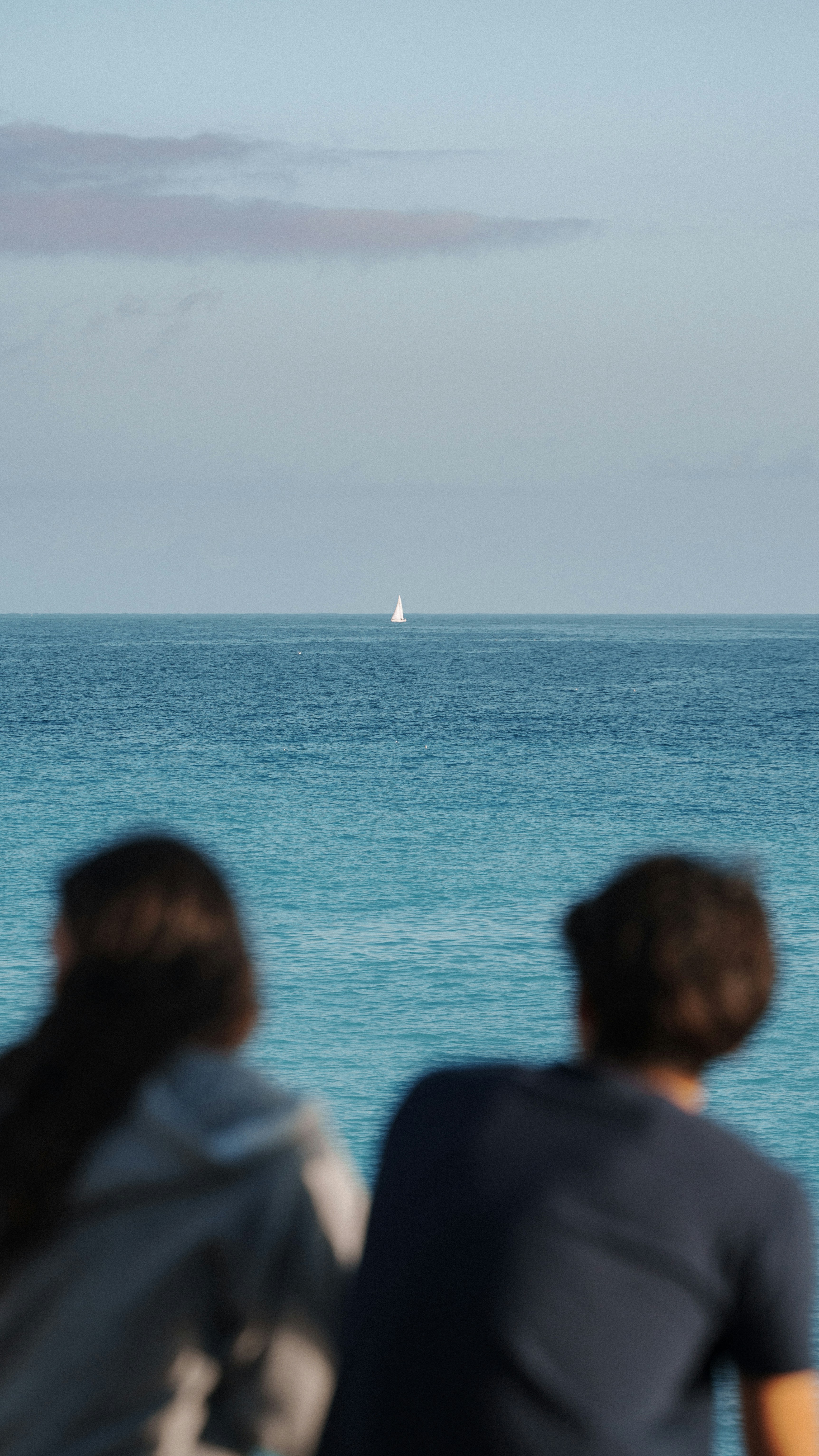 Sail on the Horizon: A Quiet Moment Beyond the Shore