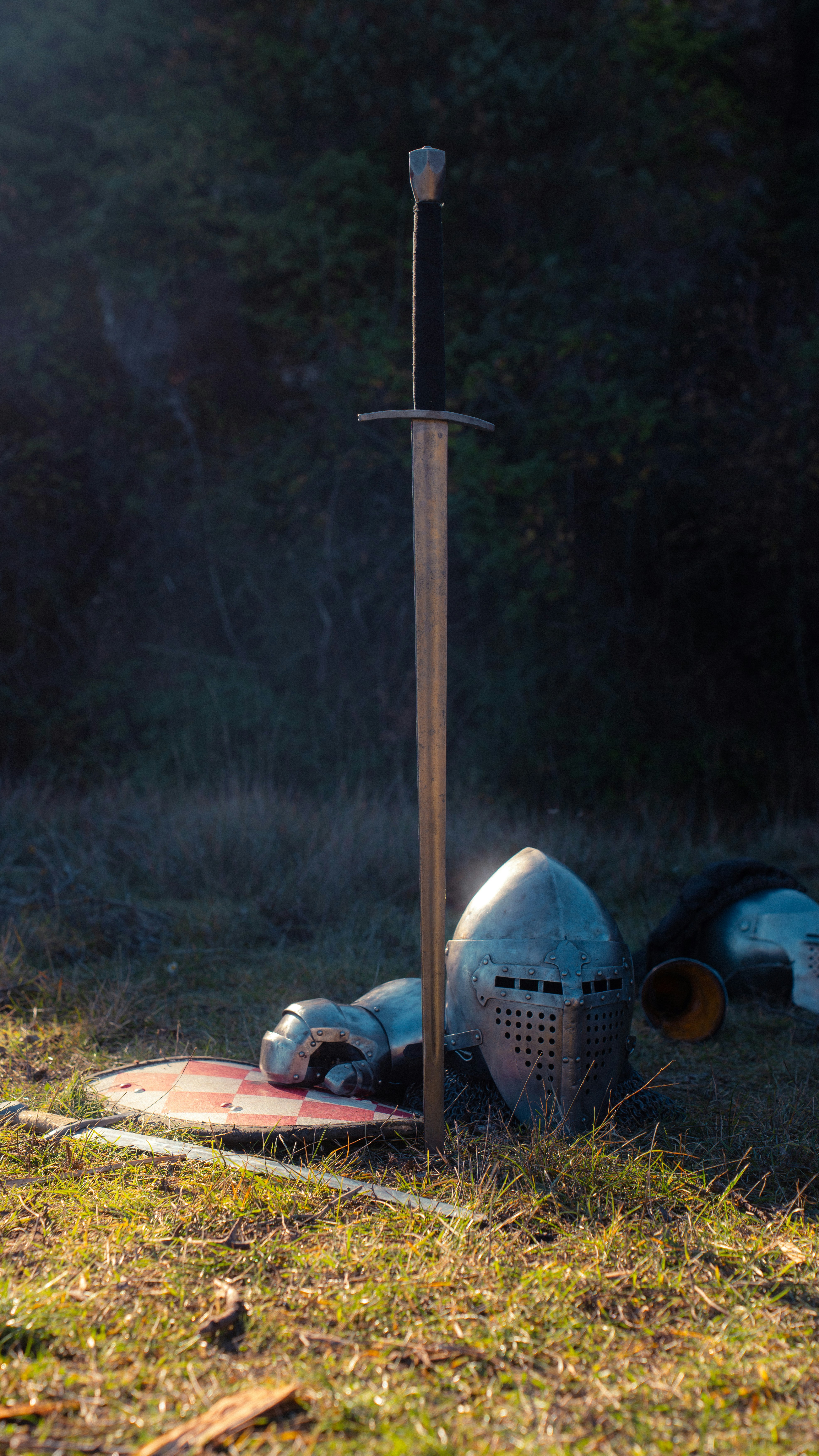 Knight's Relic at Dusk: A Sword Beckons from the Grass