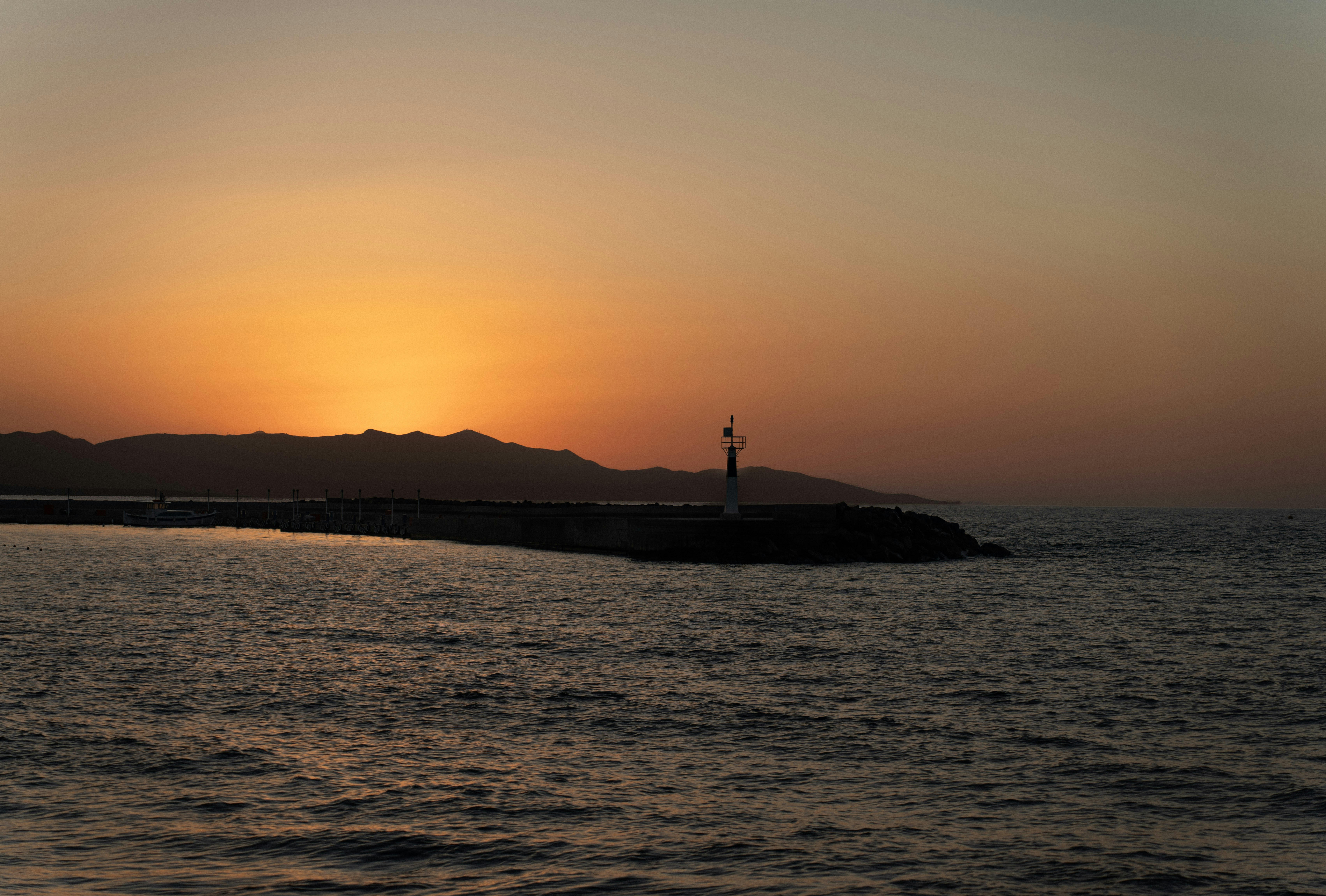 Sunset Sentinel: Lighthouse on the Quiet Break