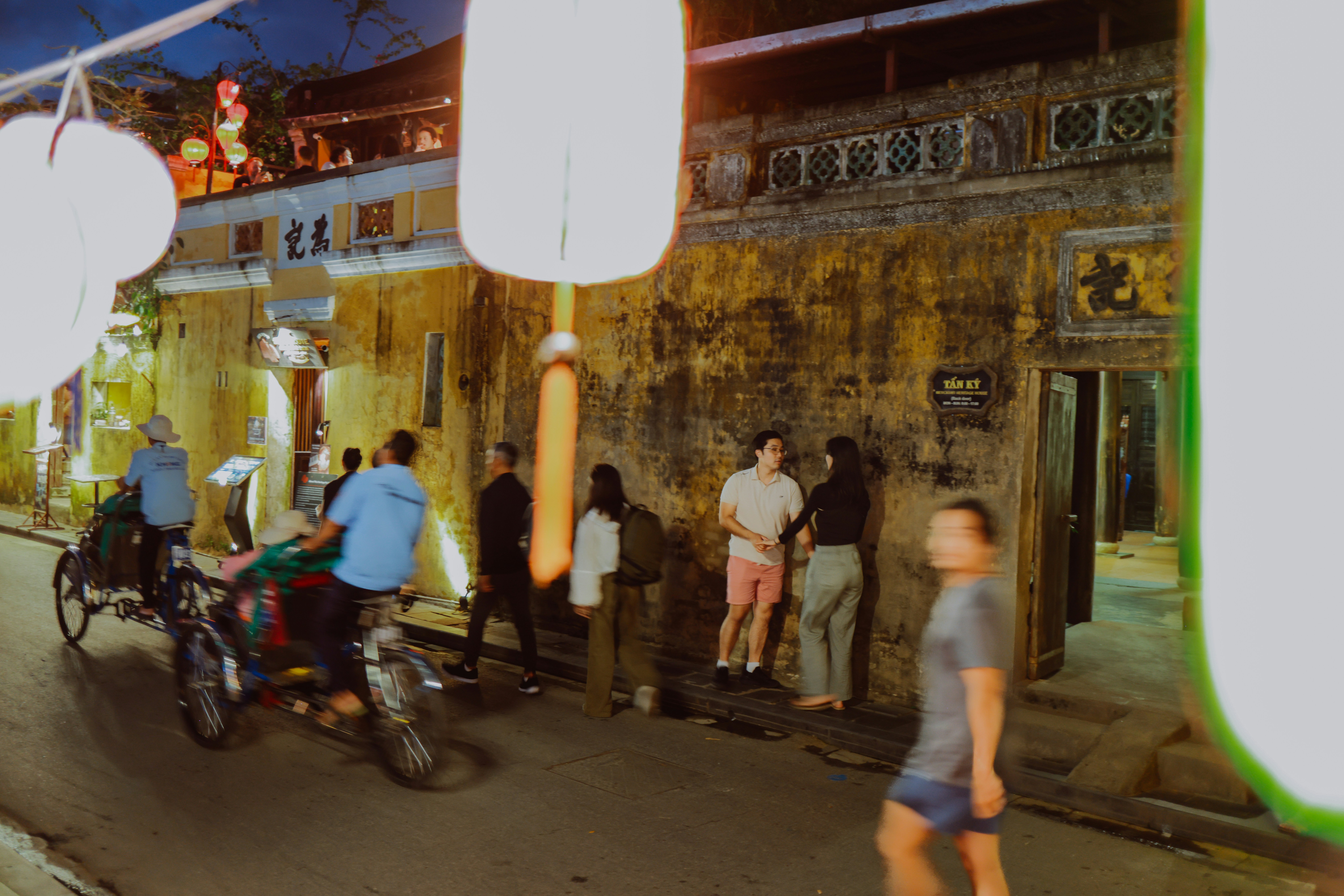 Neon Night Pedestrians on a Weathered Street
