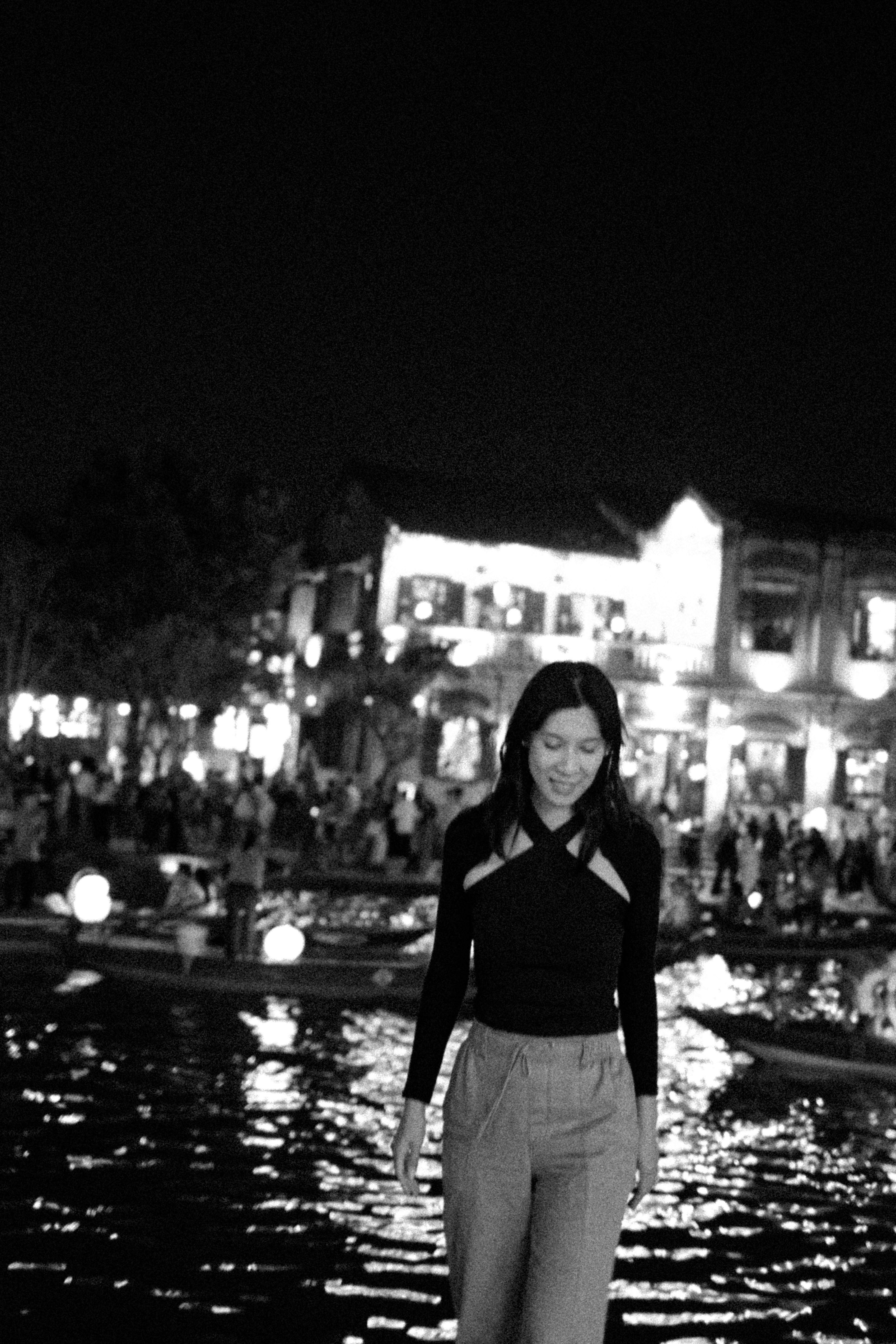 Nighttime Crescent: A Quiet Pose by the Bow-Deck Fountain
