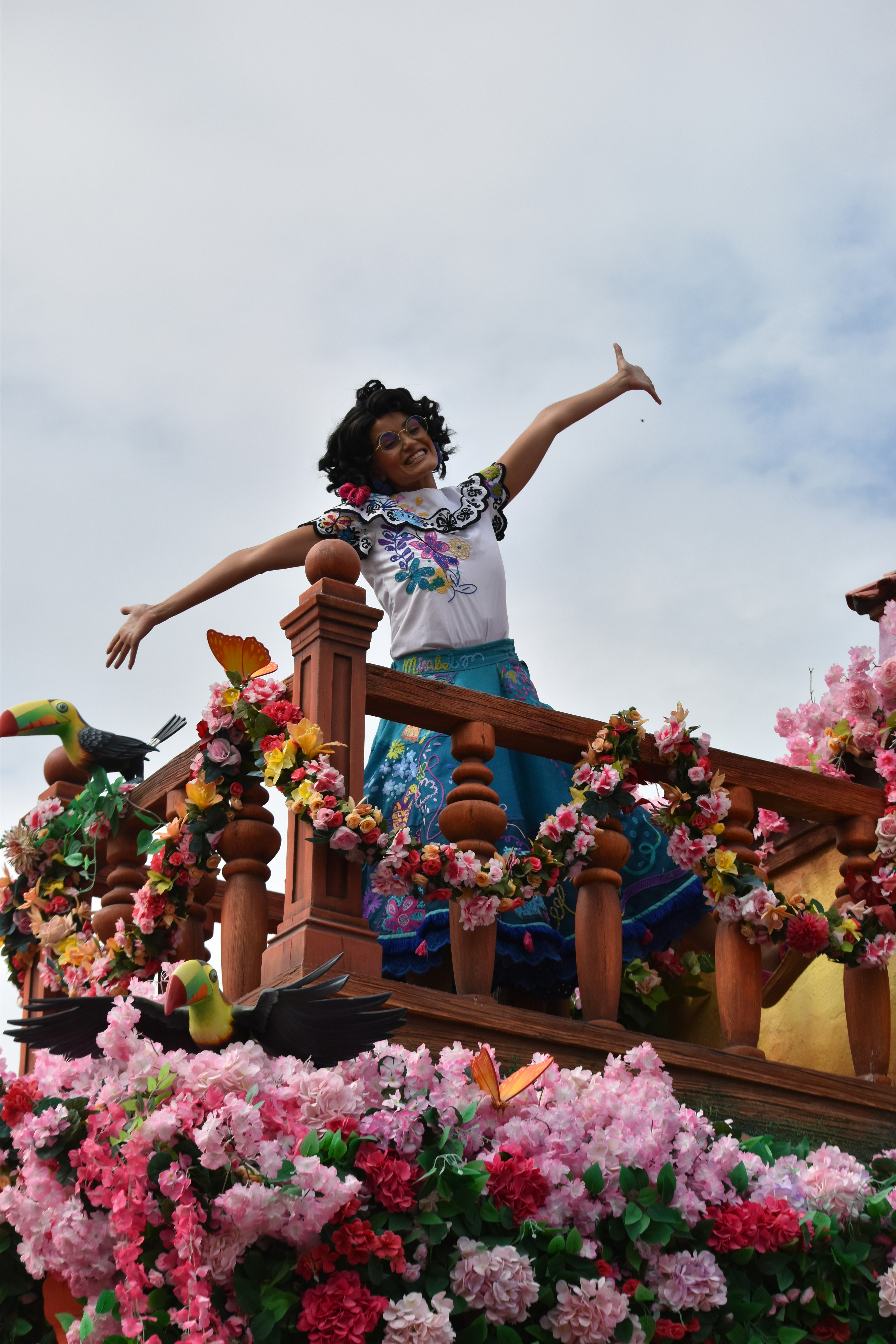 Joyful dancer on a florally adorned parade float
