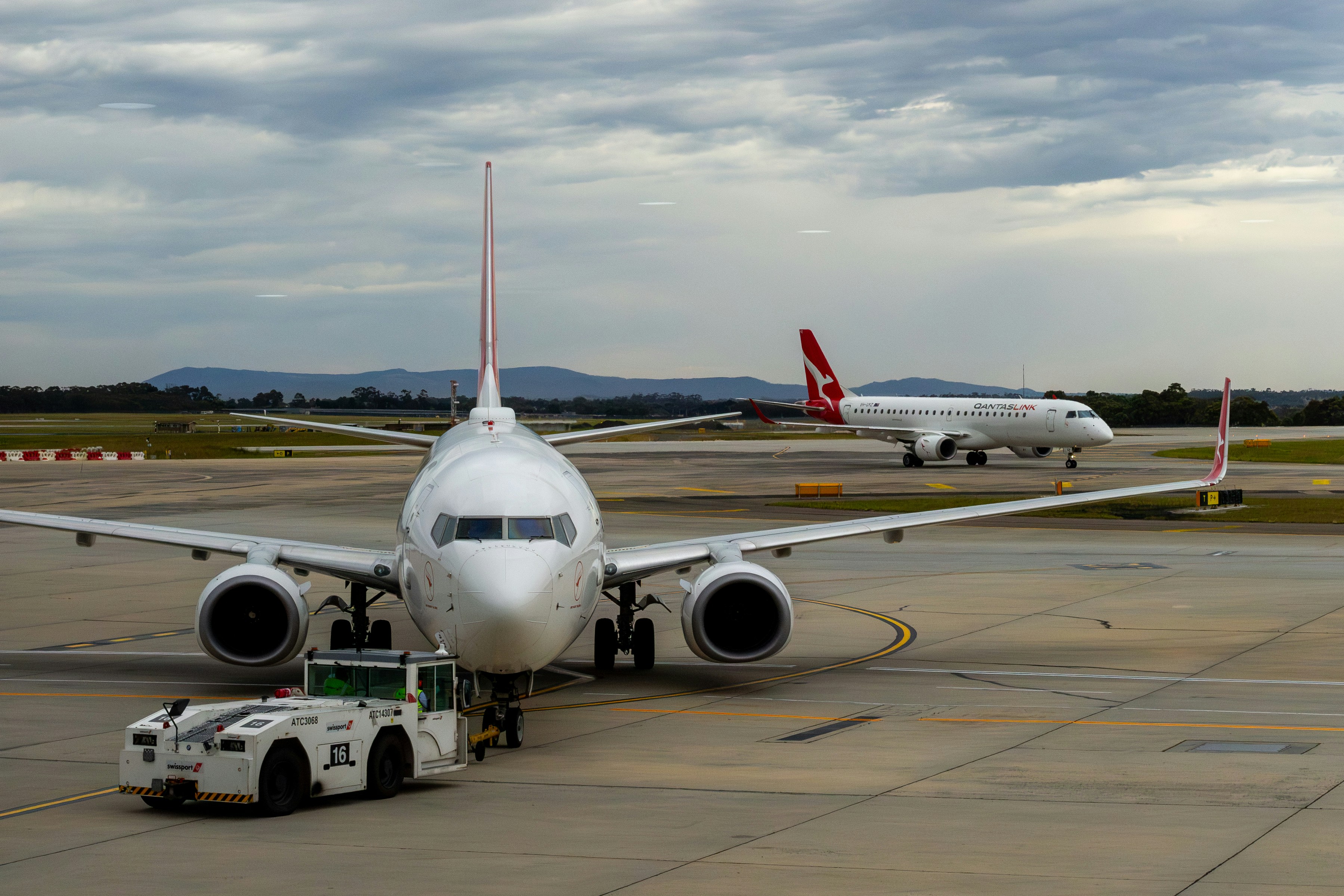 Toward the Gate: A Station-Front View of Twin-Engine Giants at the Tarmac
