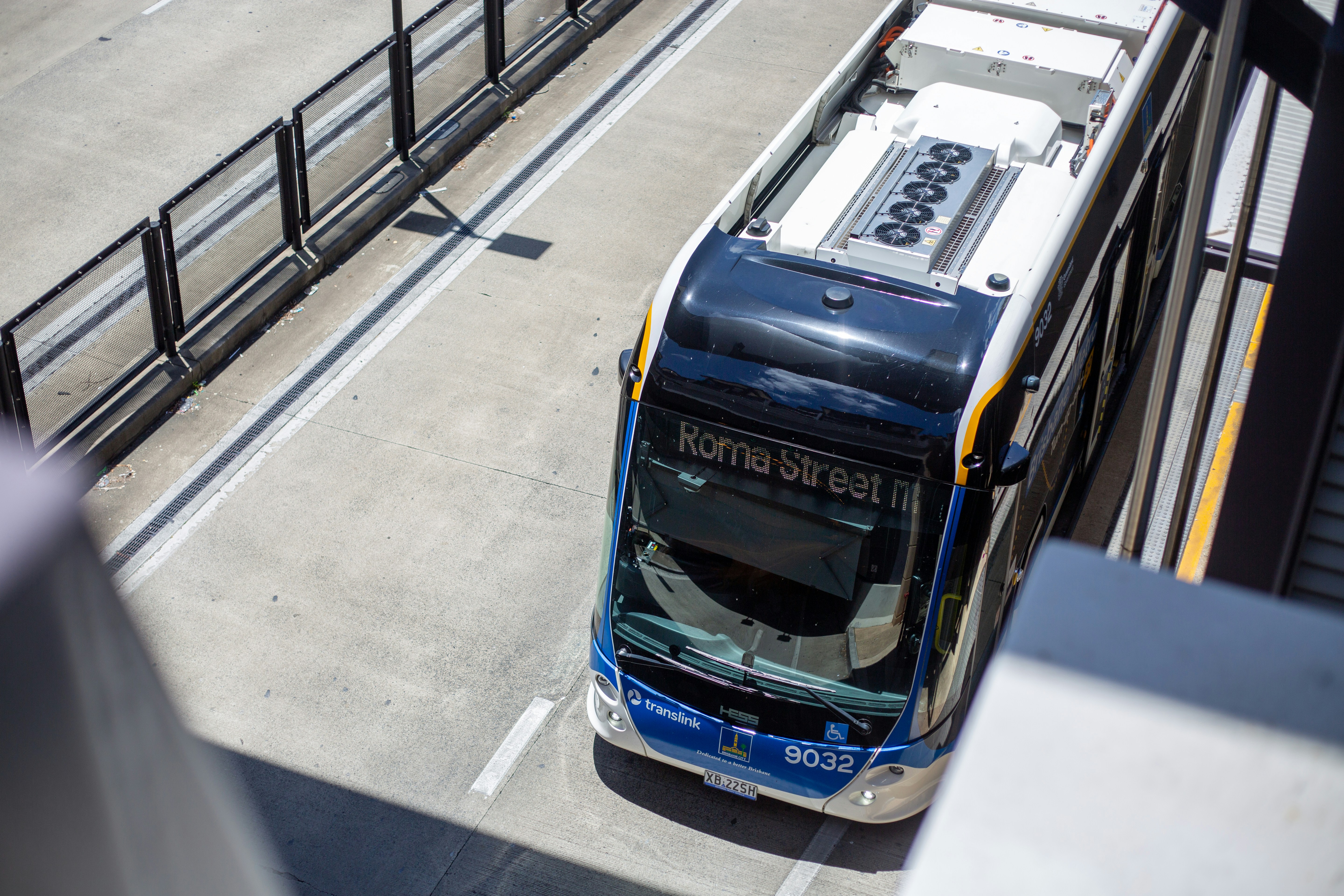 Top-Down Tram Ascent: A Blue Streetcar Earns the Urban Panorama