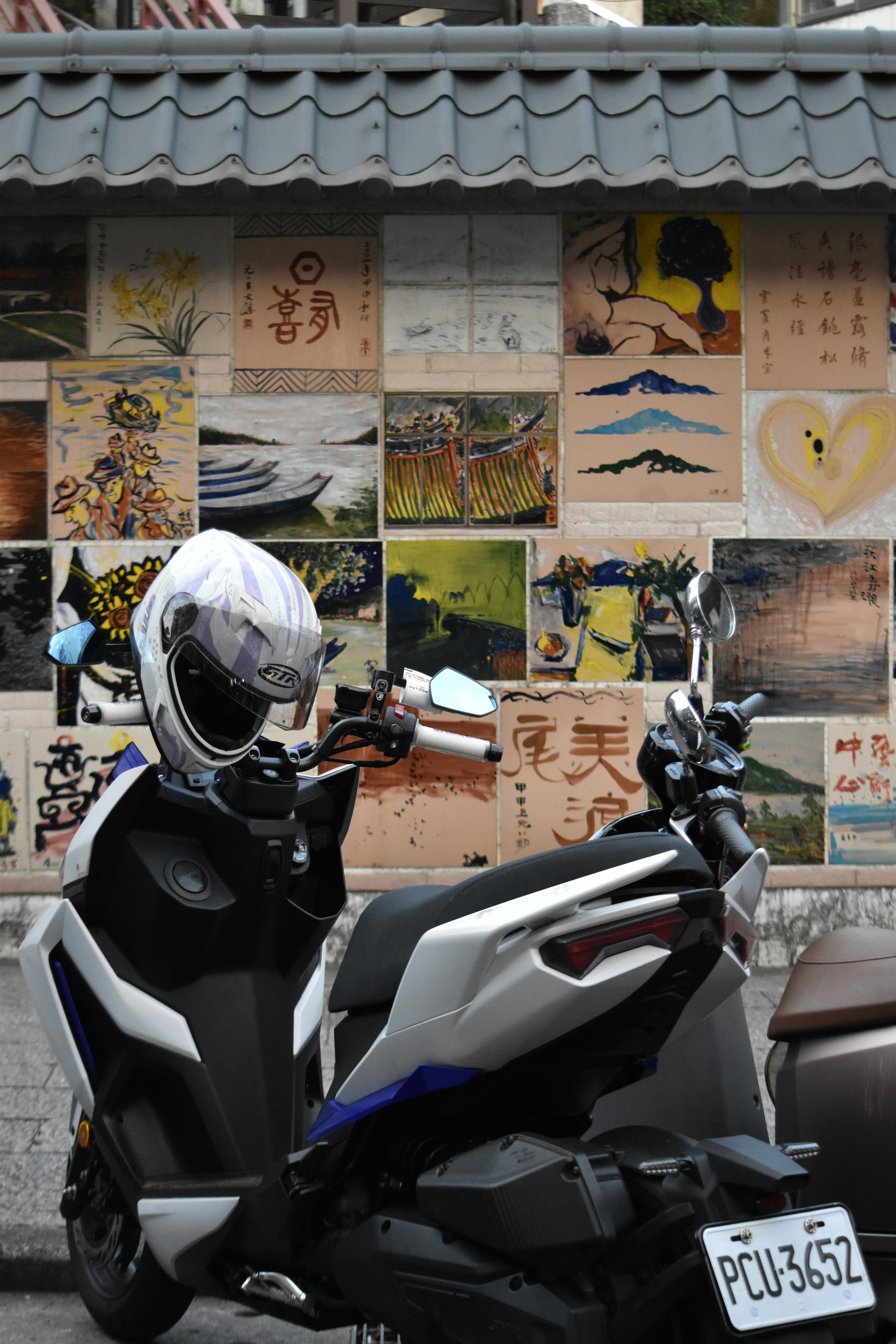 Urban Glide: A Modern Scooter Rendezvous by Painted Walls