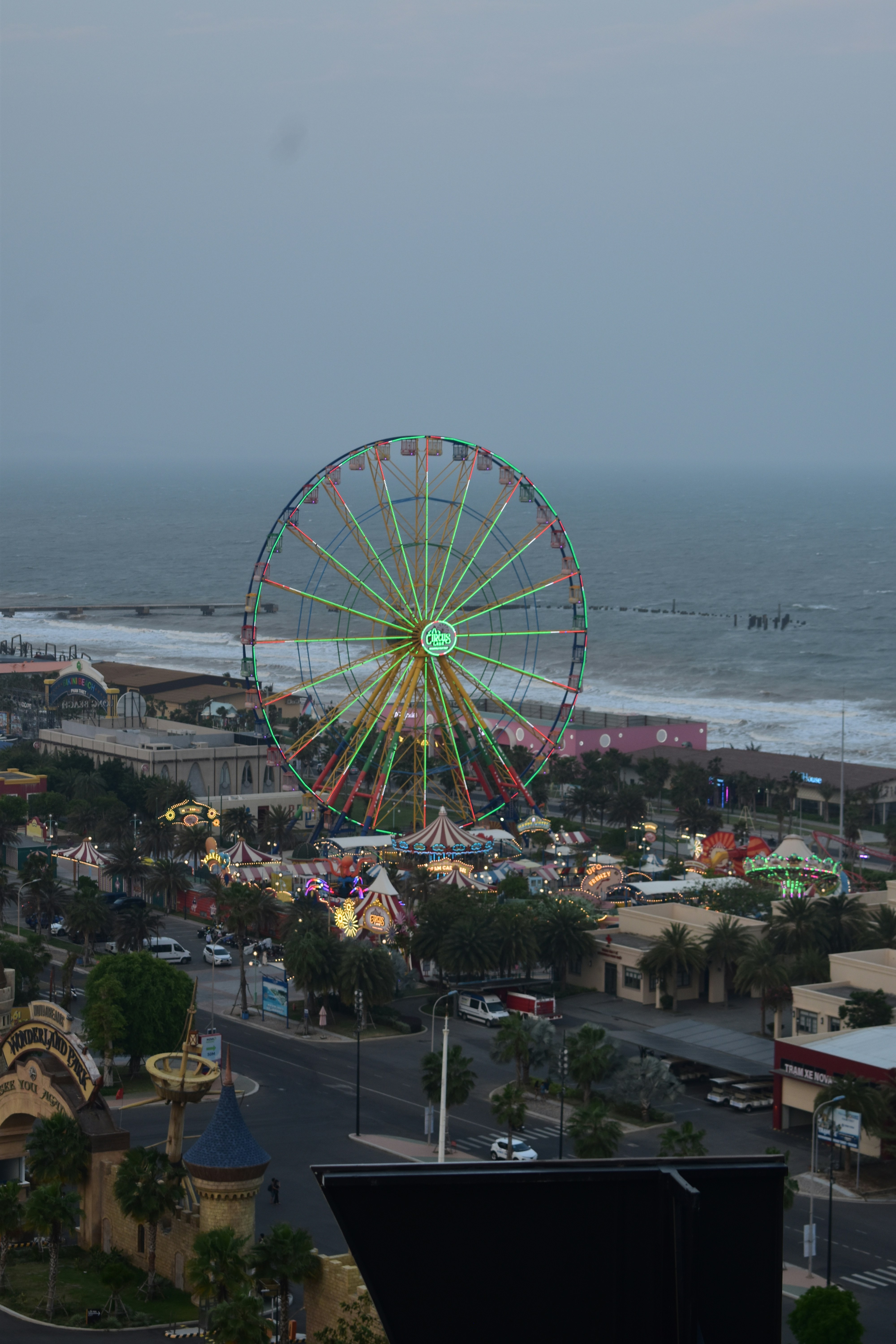 Neon Wheel Overlooking a Sunset-Soft Bay