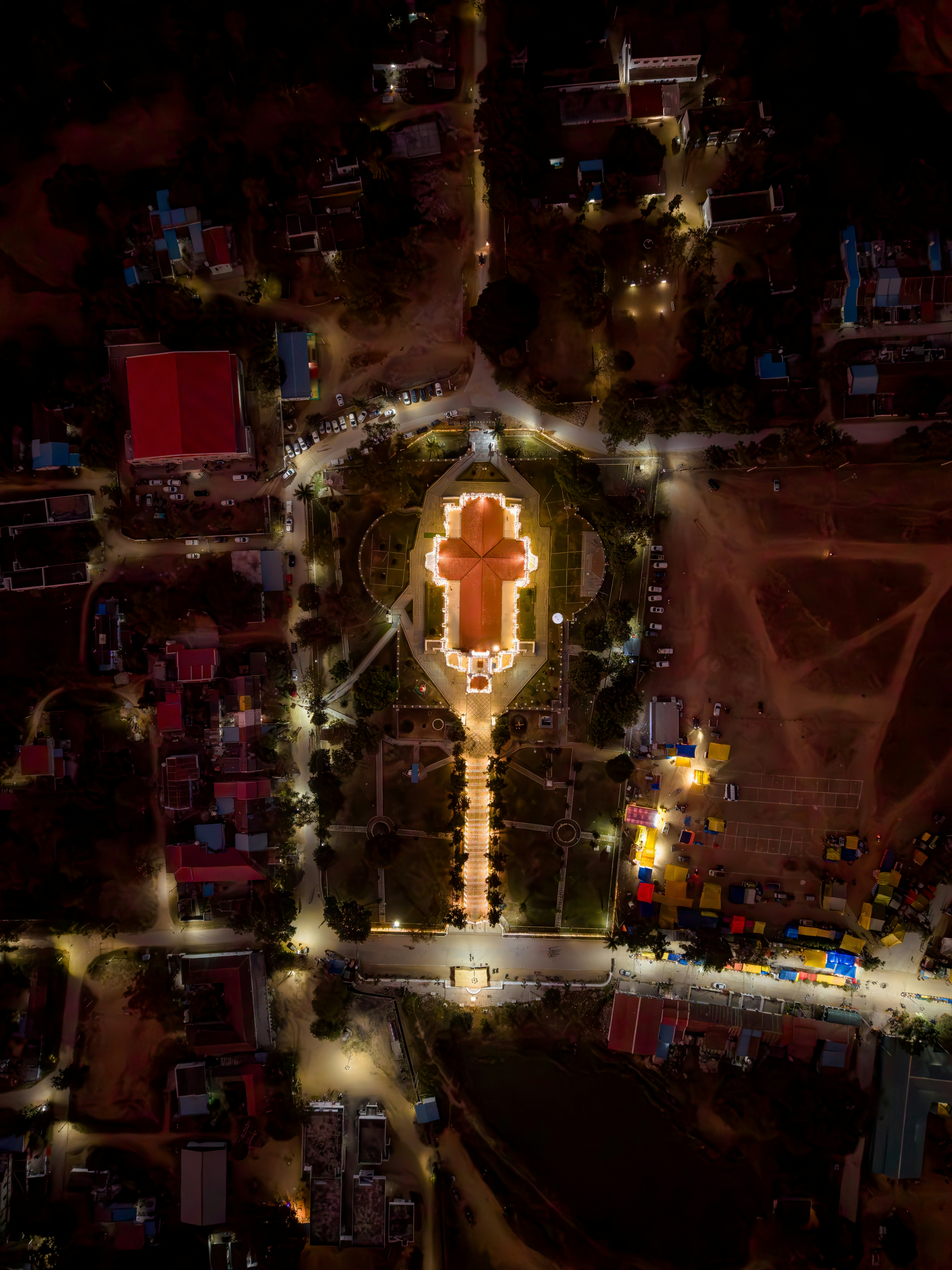 Luminous Cross in a Quiet Night Village