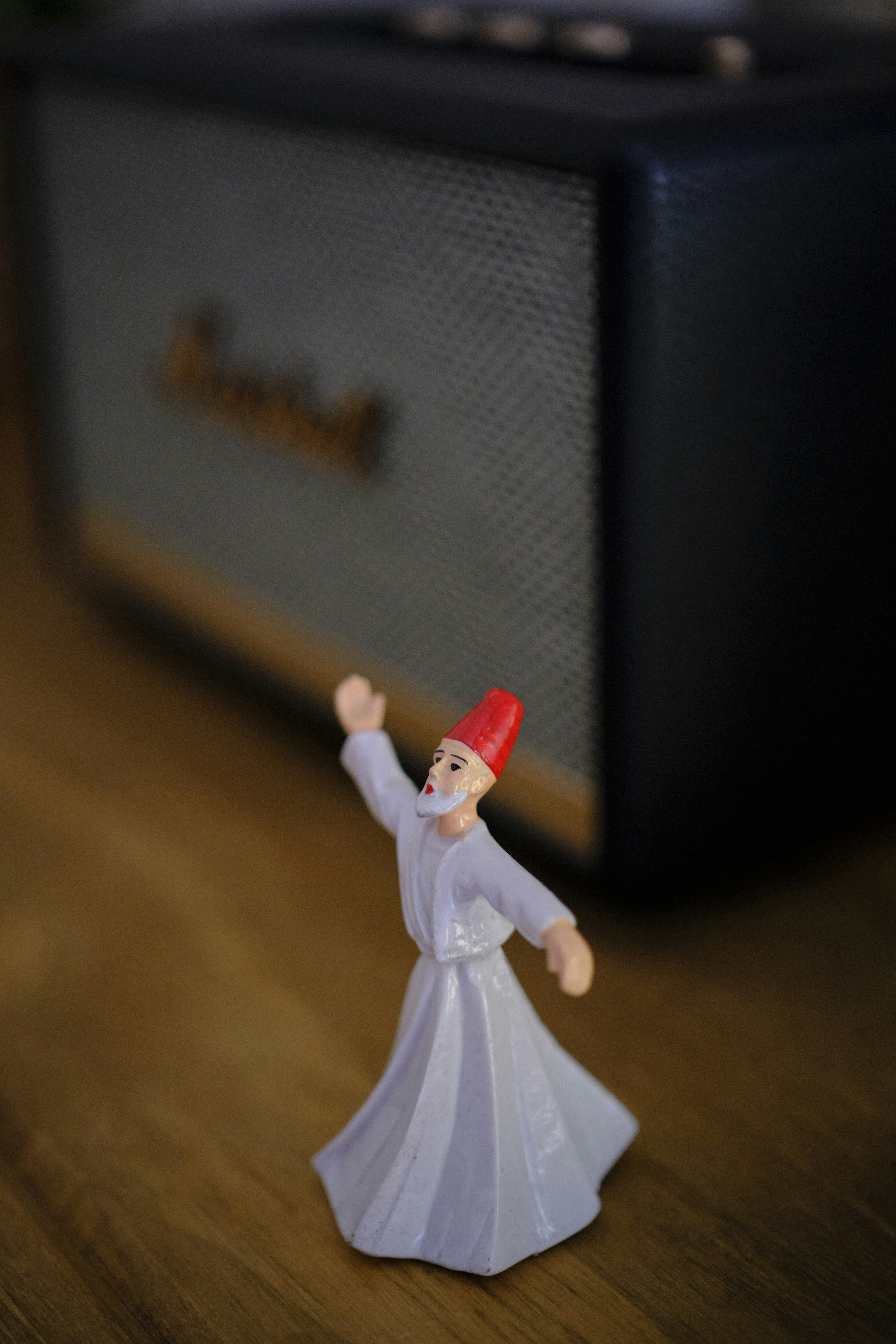 Mini Maestro in Focus: A Tiny Dervish beside a Marshall