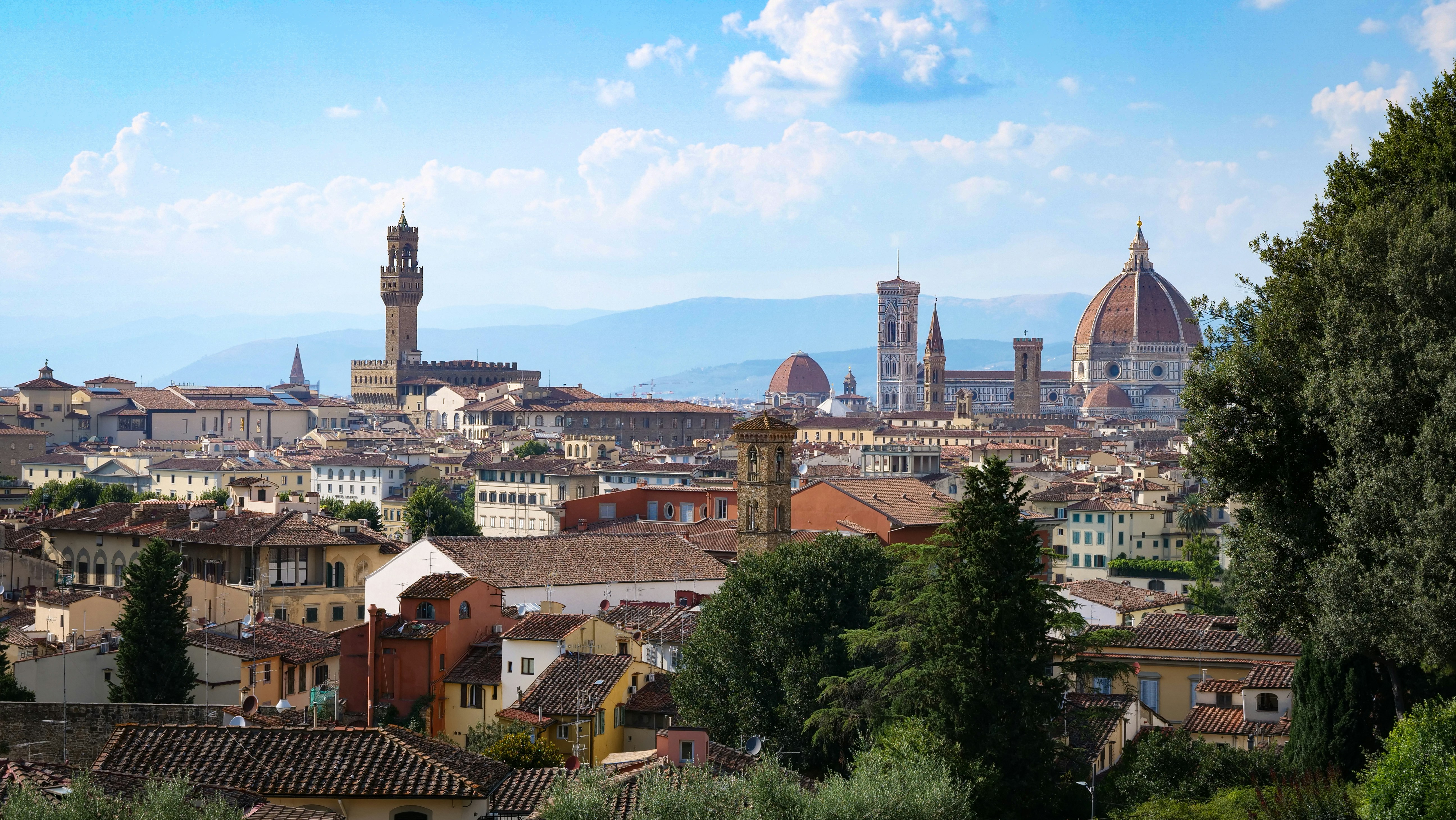 Florence cityscape with duomo and palazzo vecchio visible.