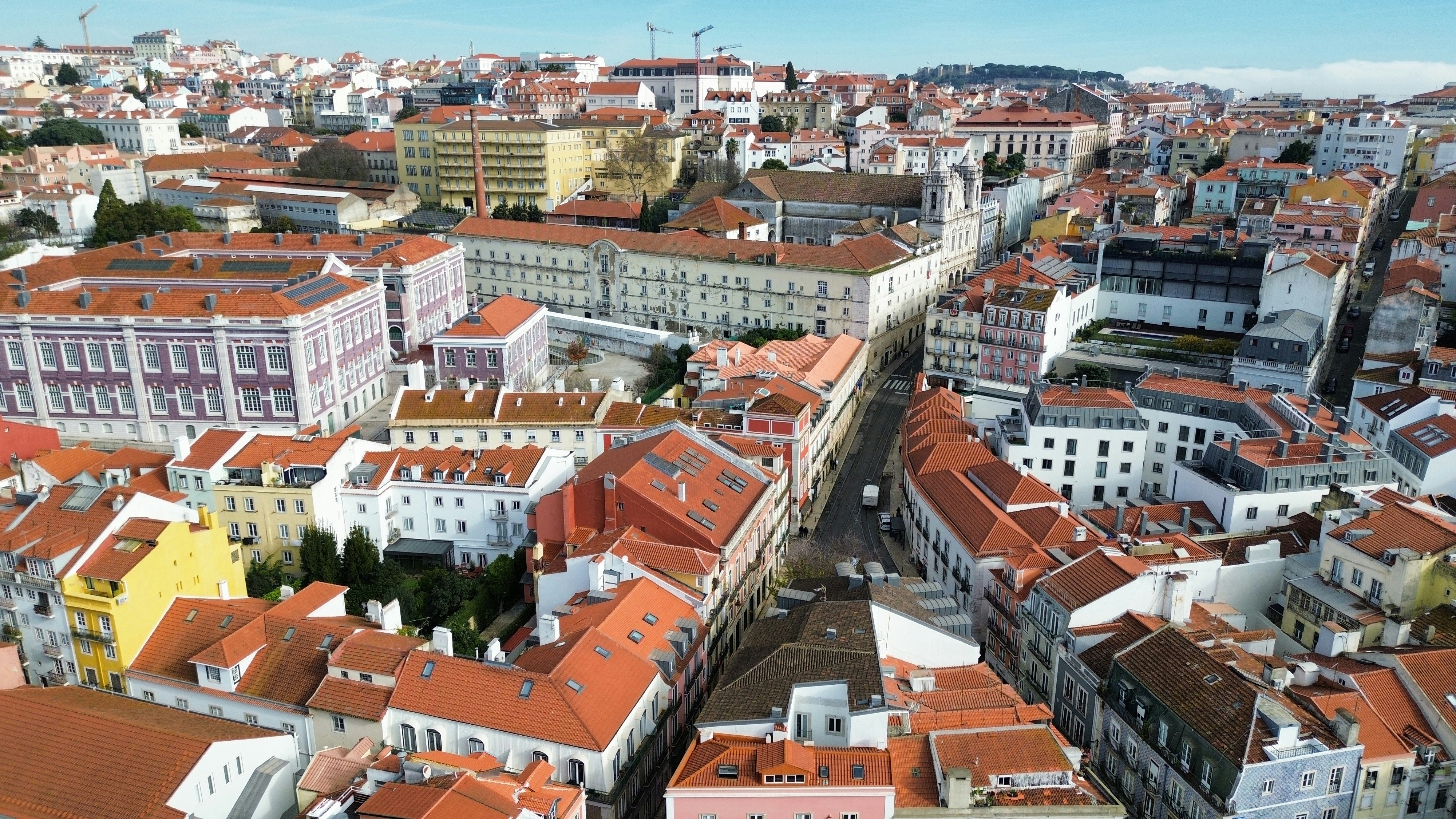 Aerial tapestry of terracotta roofs and pastel façades