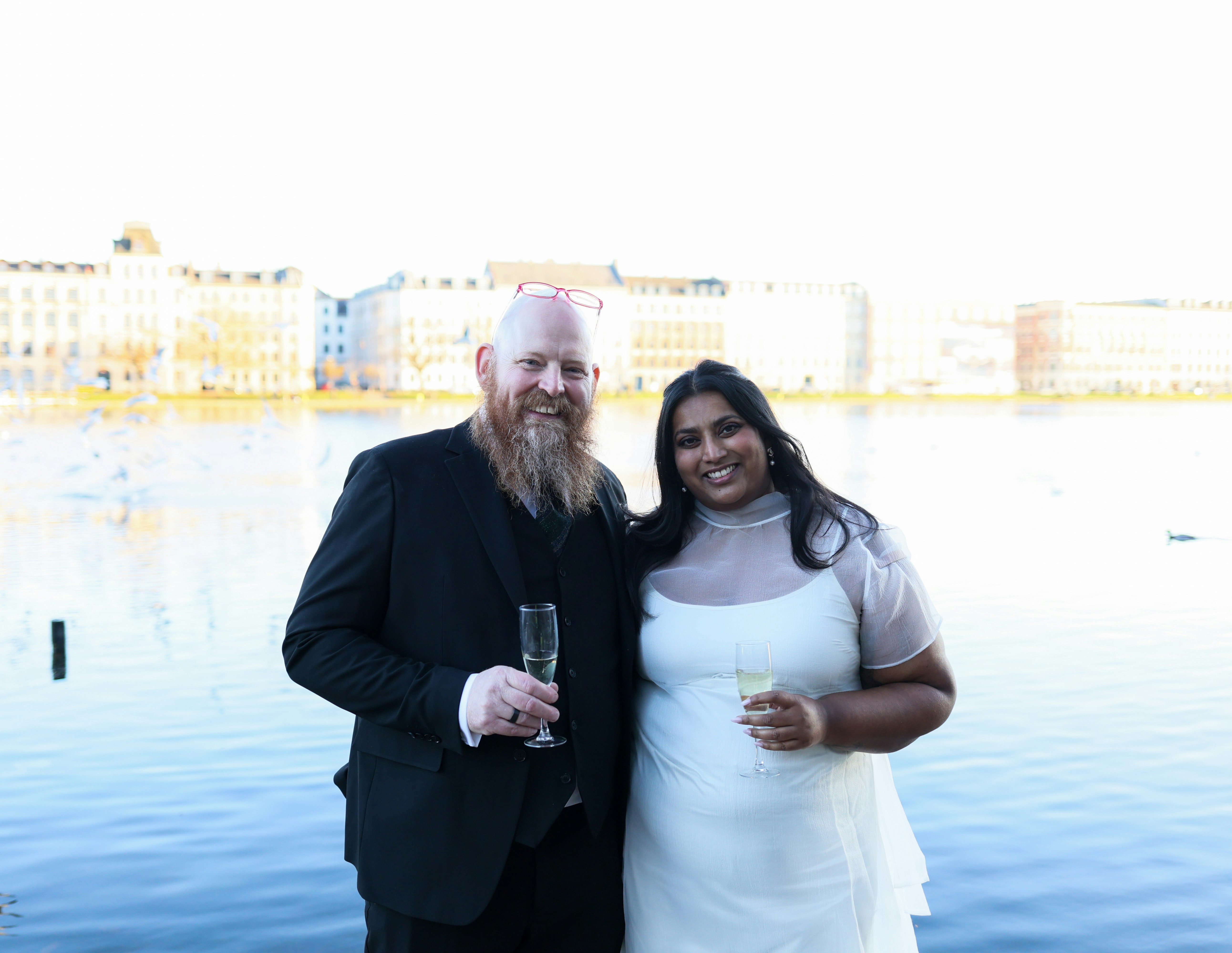 Toast by the Waterfront: Two Friends in Evening Light