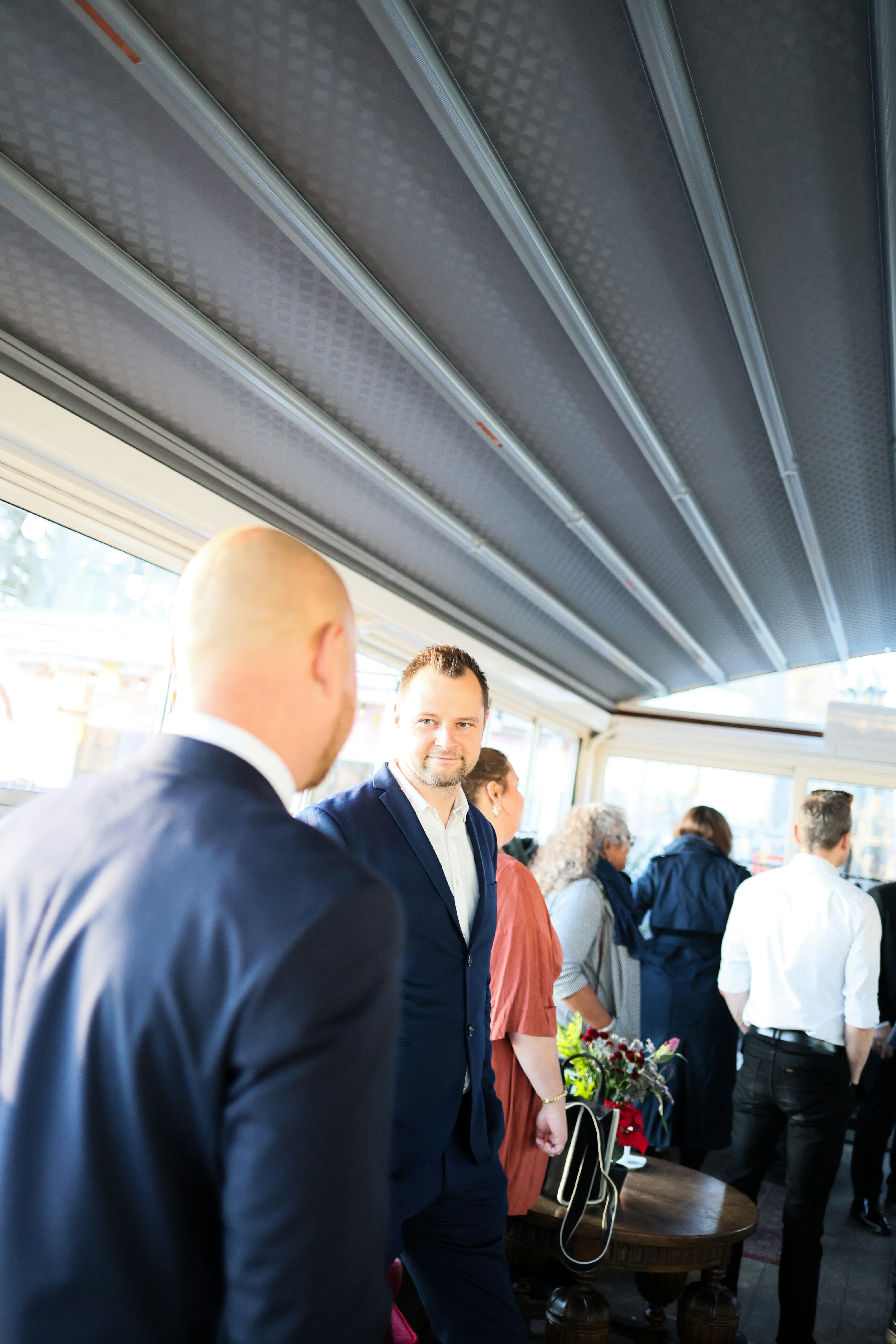 Mid-Conversation Moment: A Confident Gentleman In a Crowd