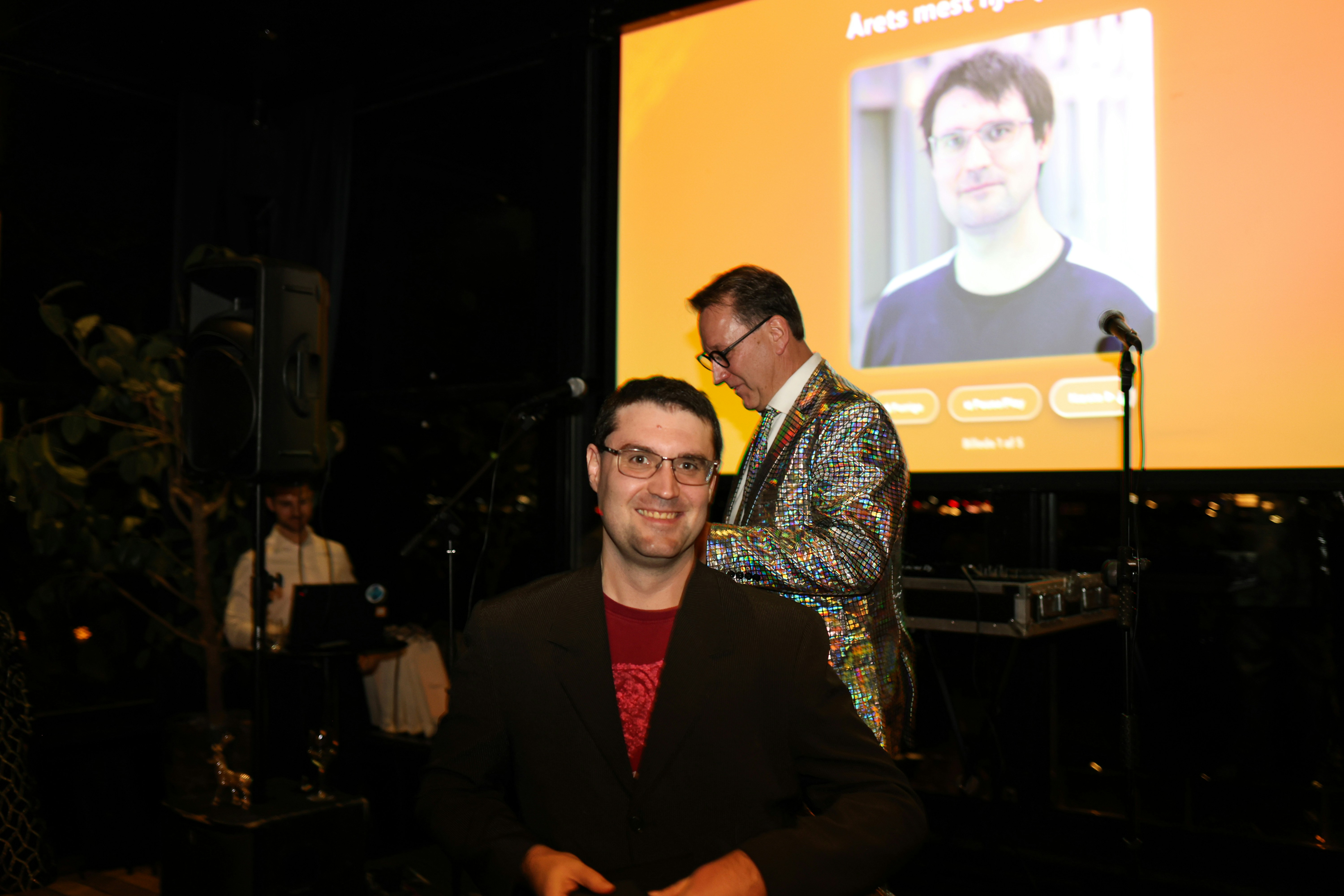 Confident Host in the Spotlight at a Stage Event
