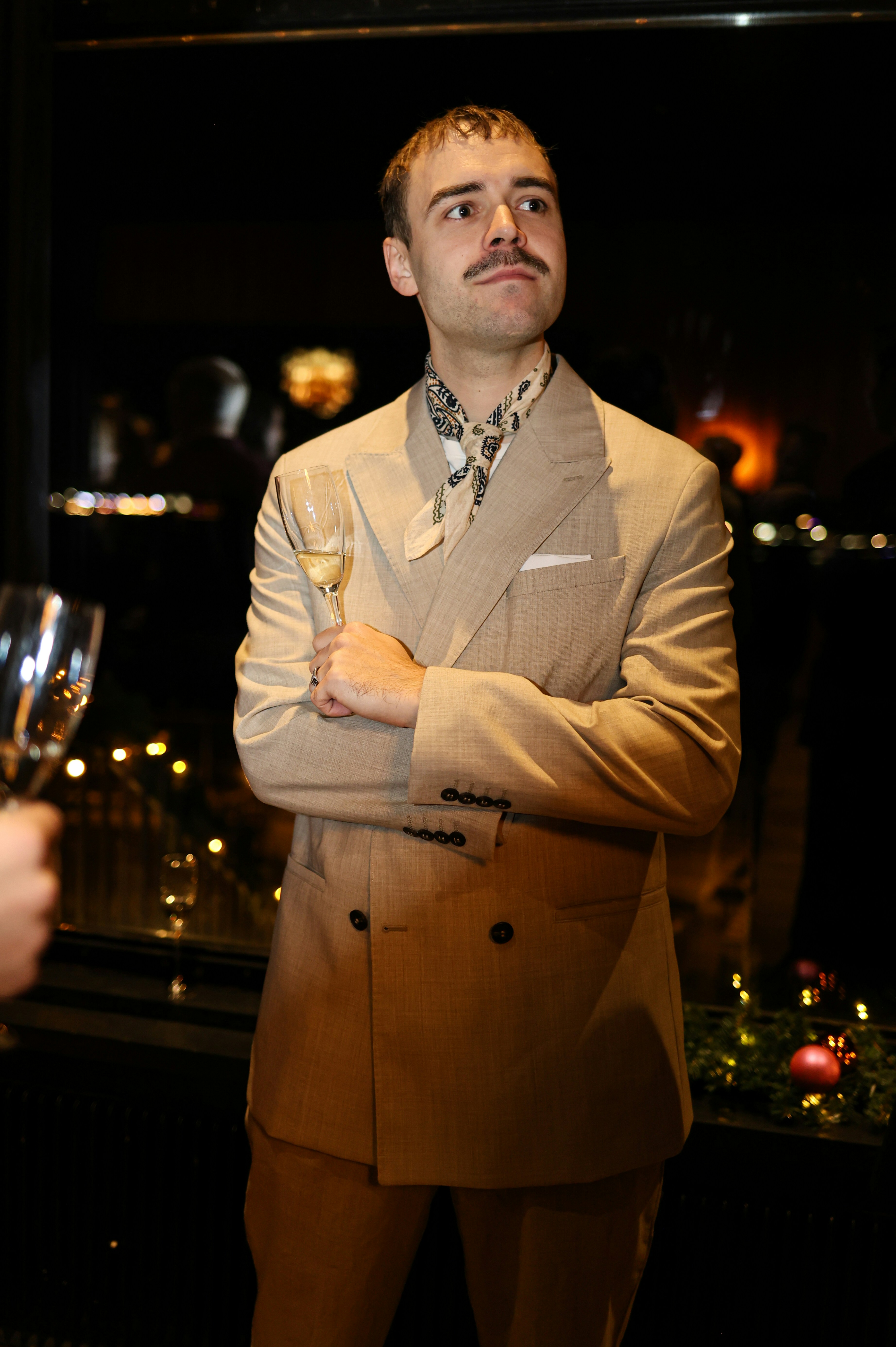 Gentleman in Gentlemanly Gaze at a Dimly Lit Gala