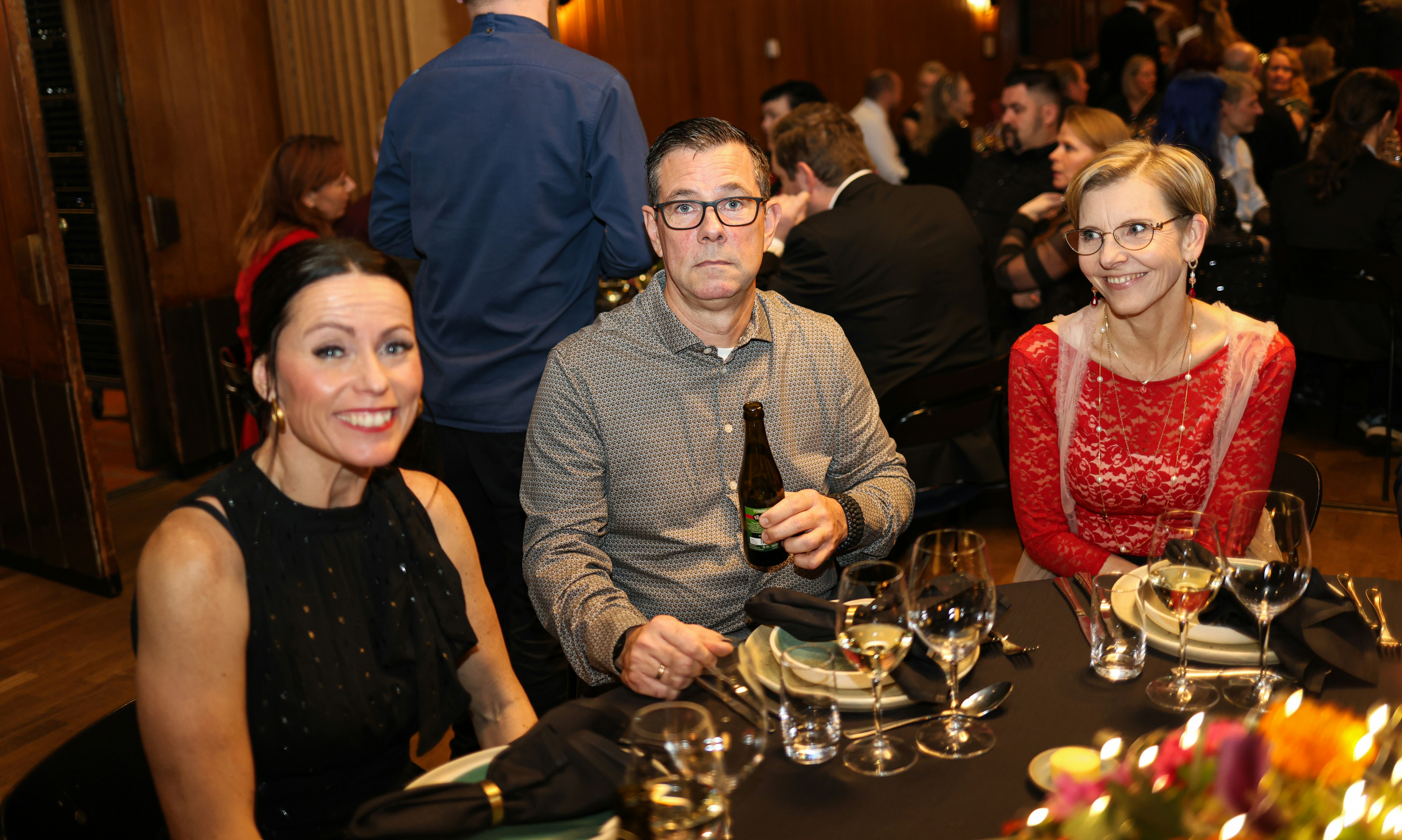 Midnight Toast: Three Friends Around a Reception Table