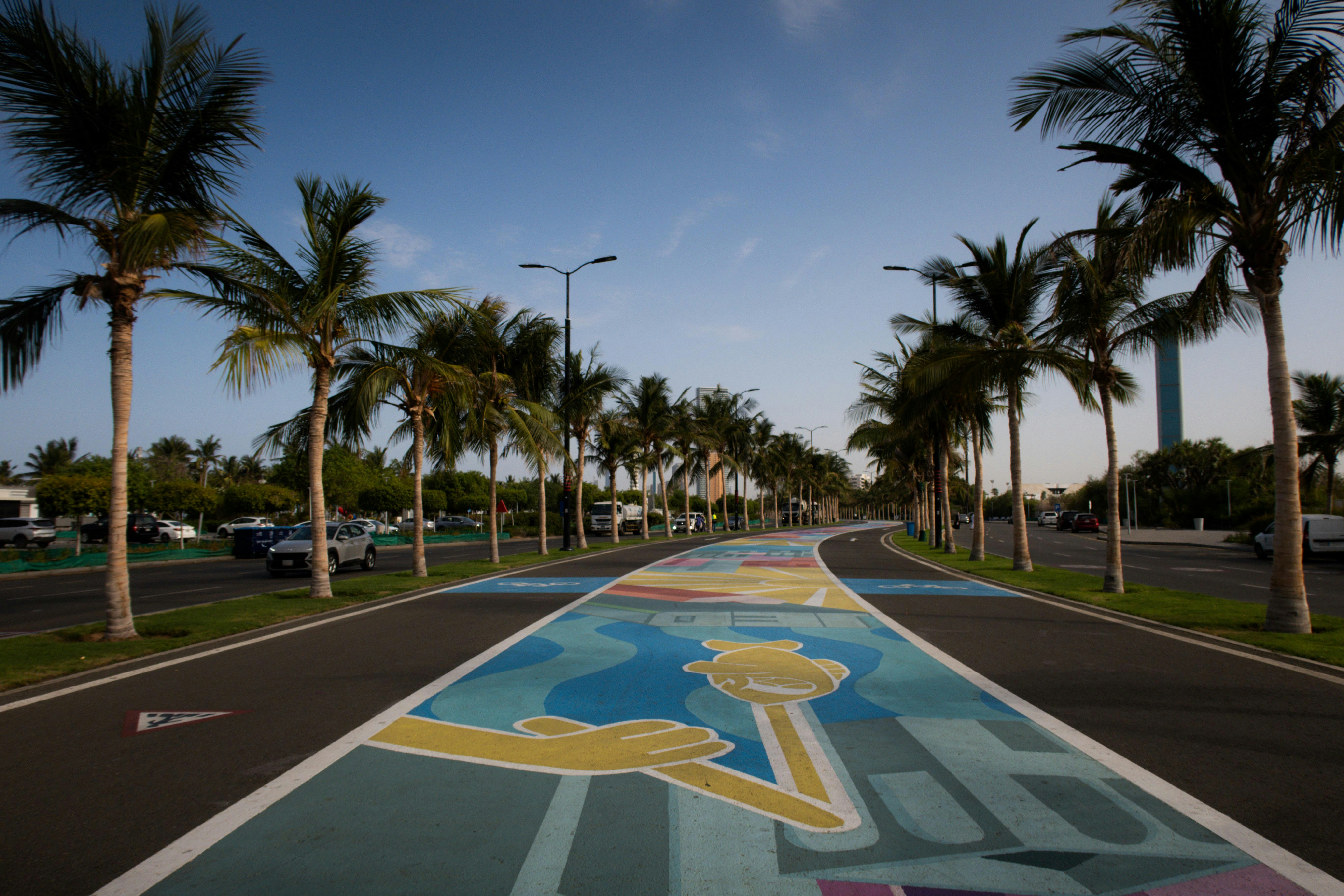 Colorful Road Art Leads the Palm-Lined Boulevard
