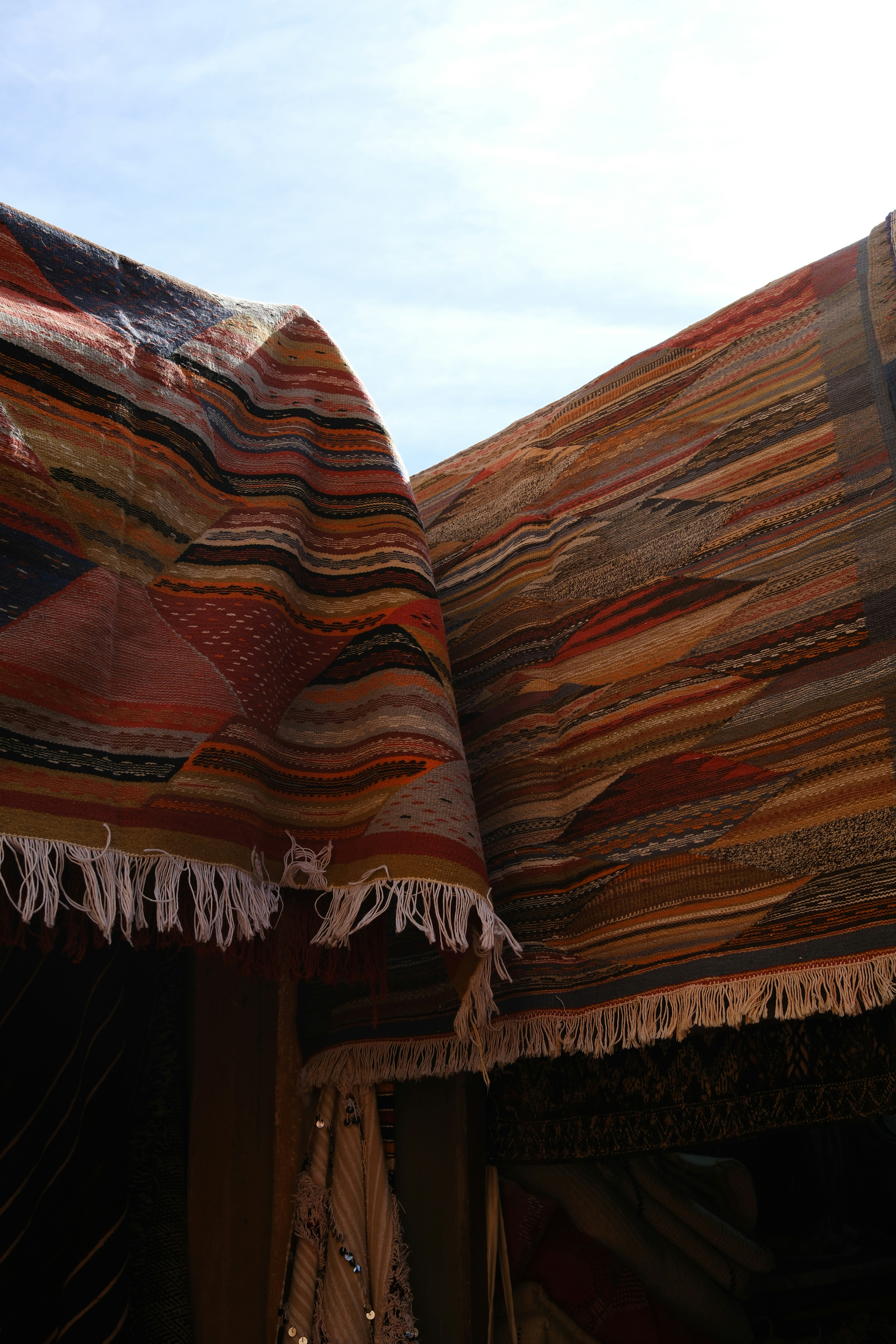 Between Woven Peaks: A Tapestry Bends the Light