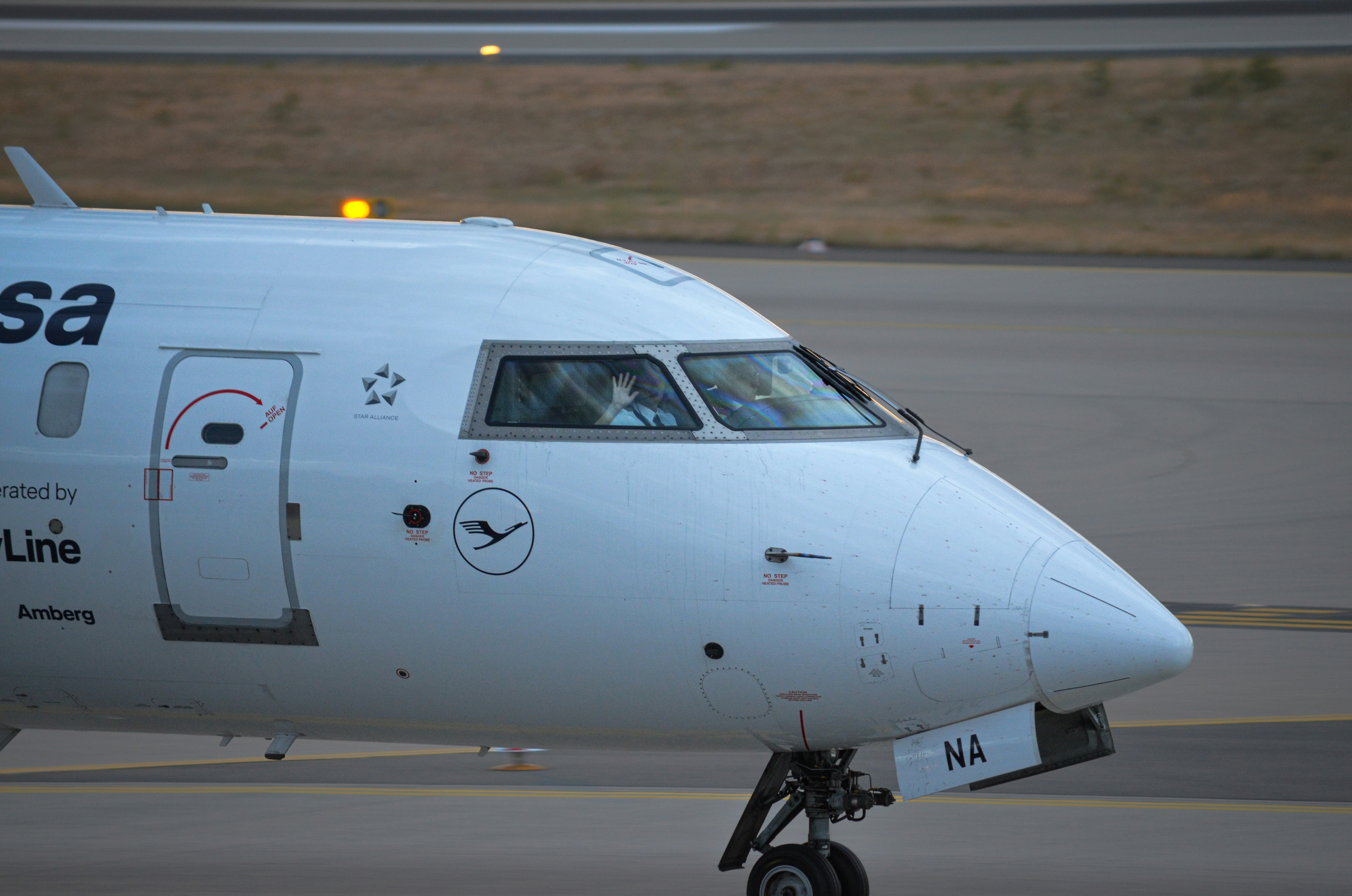 Cockpit Focus: Side-On Portrait of a Commercial Jet at Tarmac Level