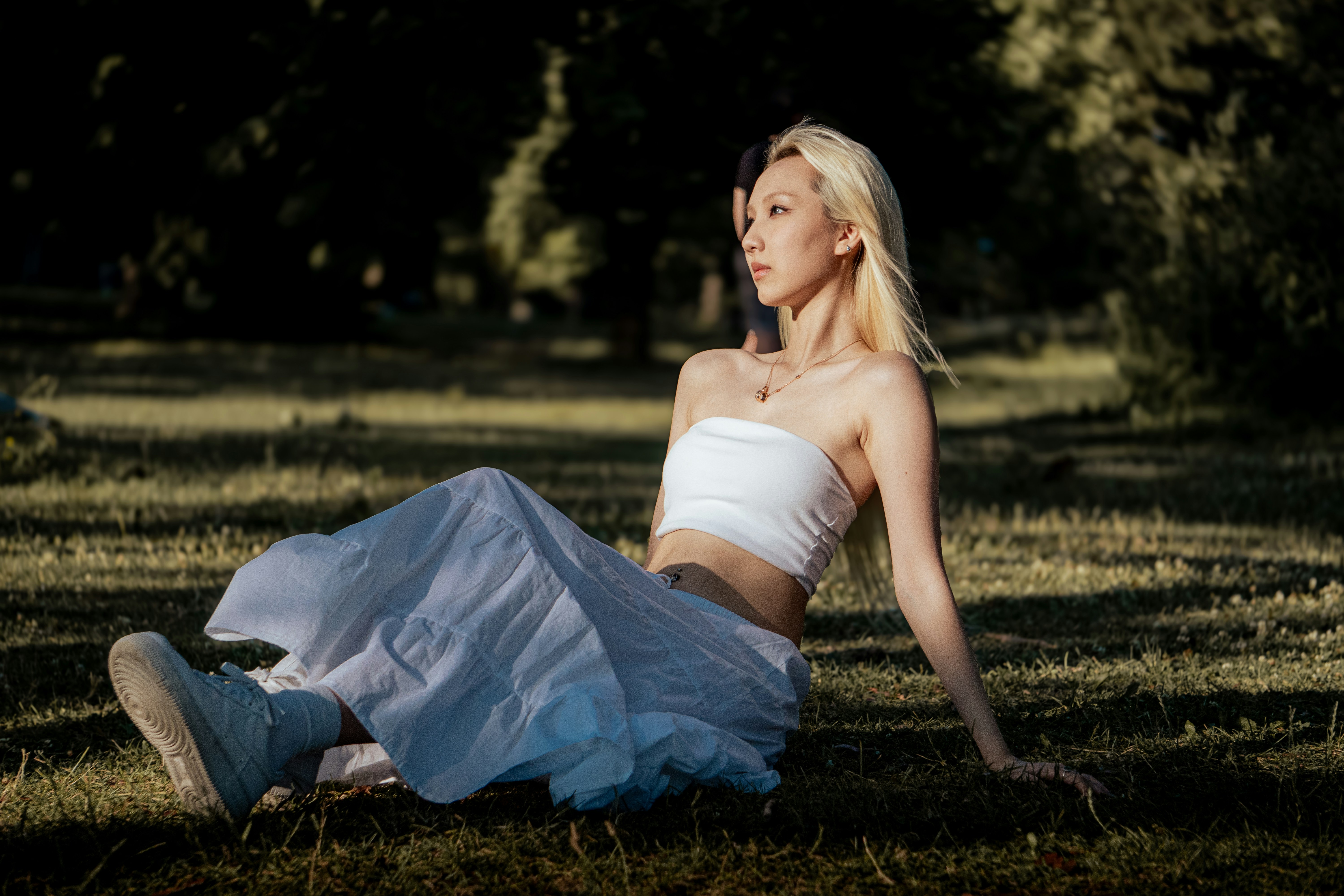 Sunlit Denim: A Quiet Portrait in the Park