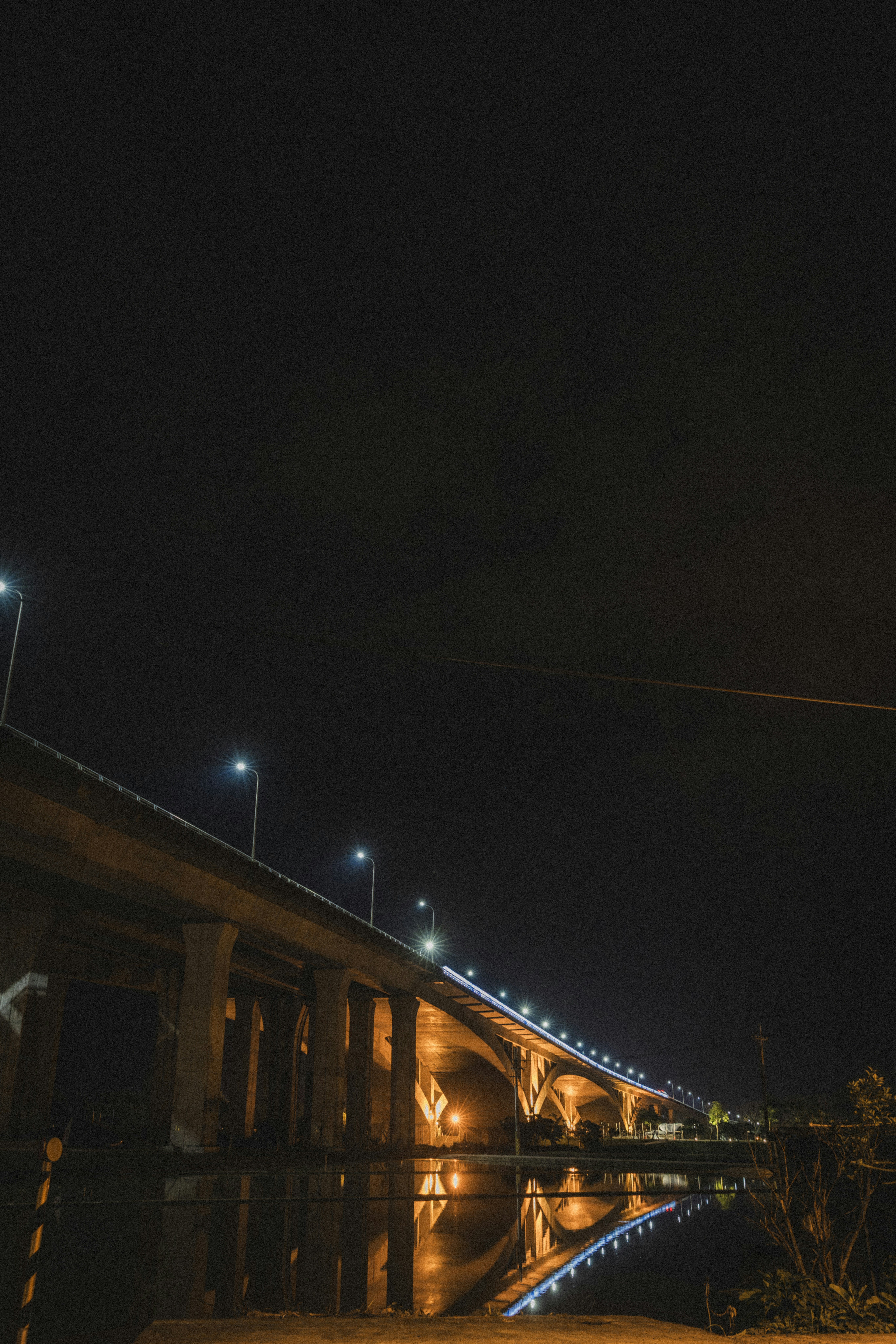 Moonlit Bridge Echoes: Reflections on a Quiet Water