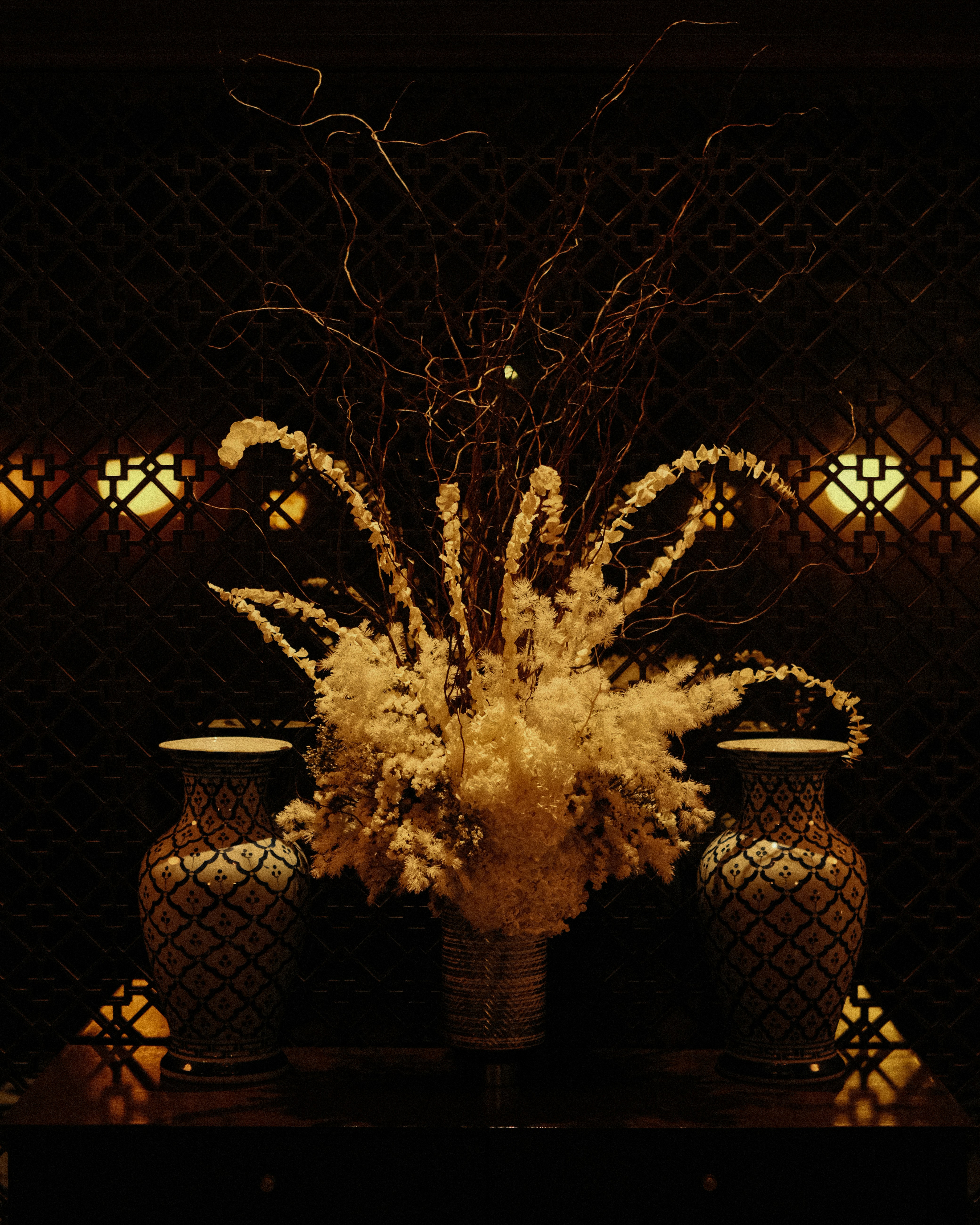 Golden Floral Arrangement in an Ornate Dimly Lit Niche