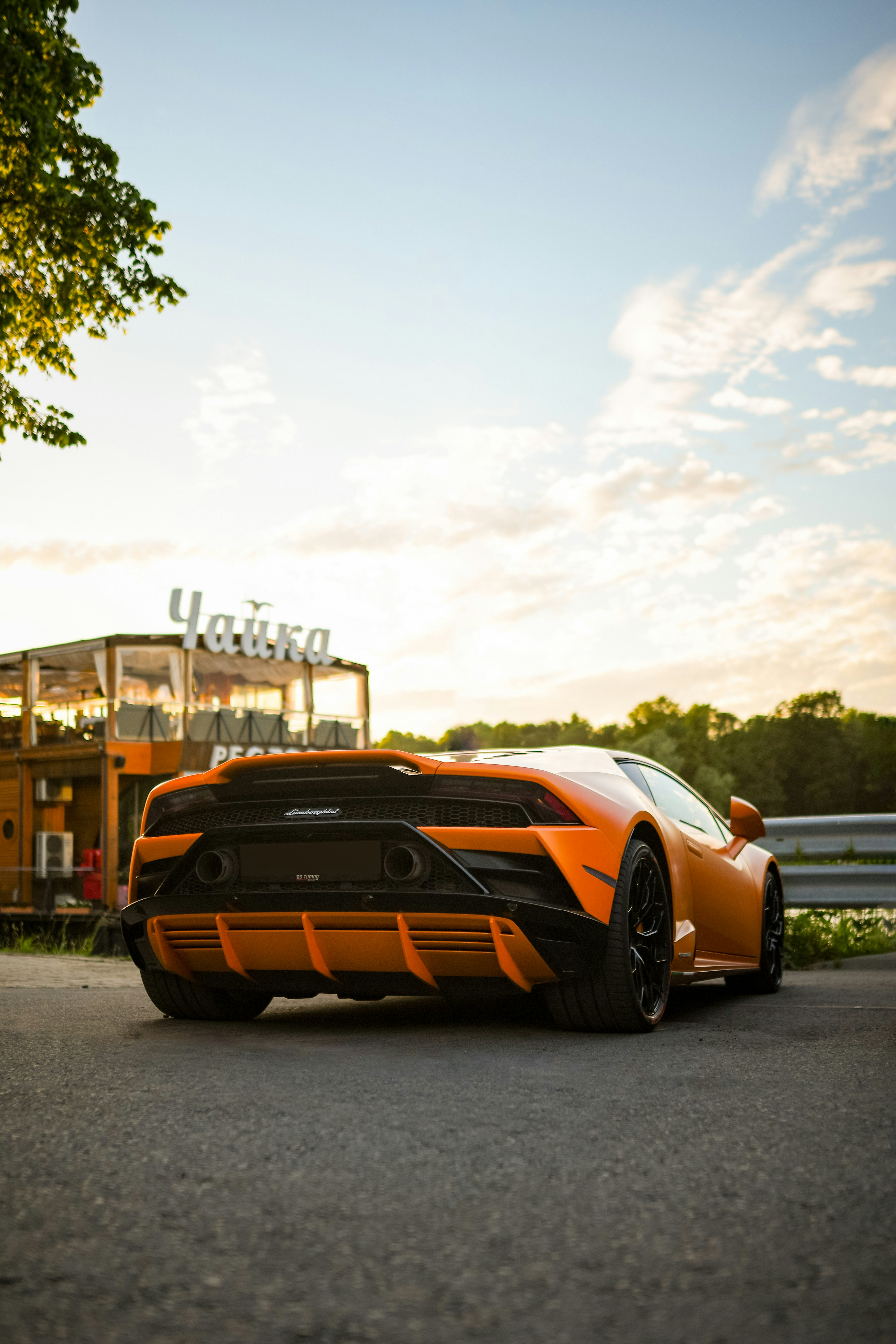 Orange Thunder: A Low-Rlung Vantage of a Supercar at Sunset