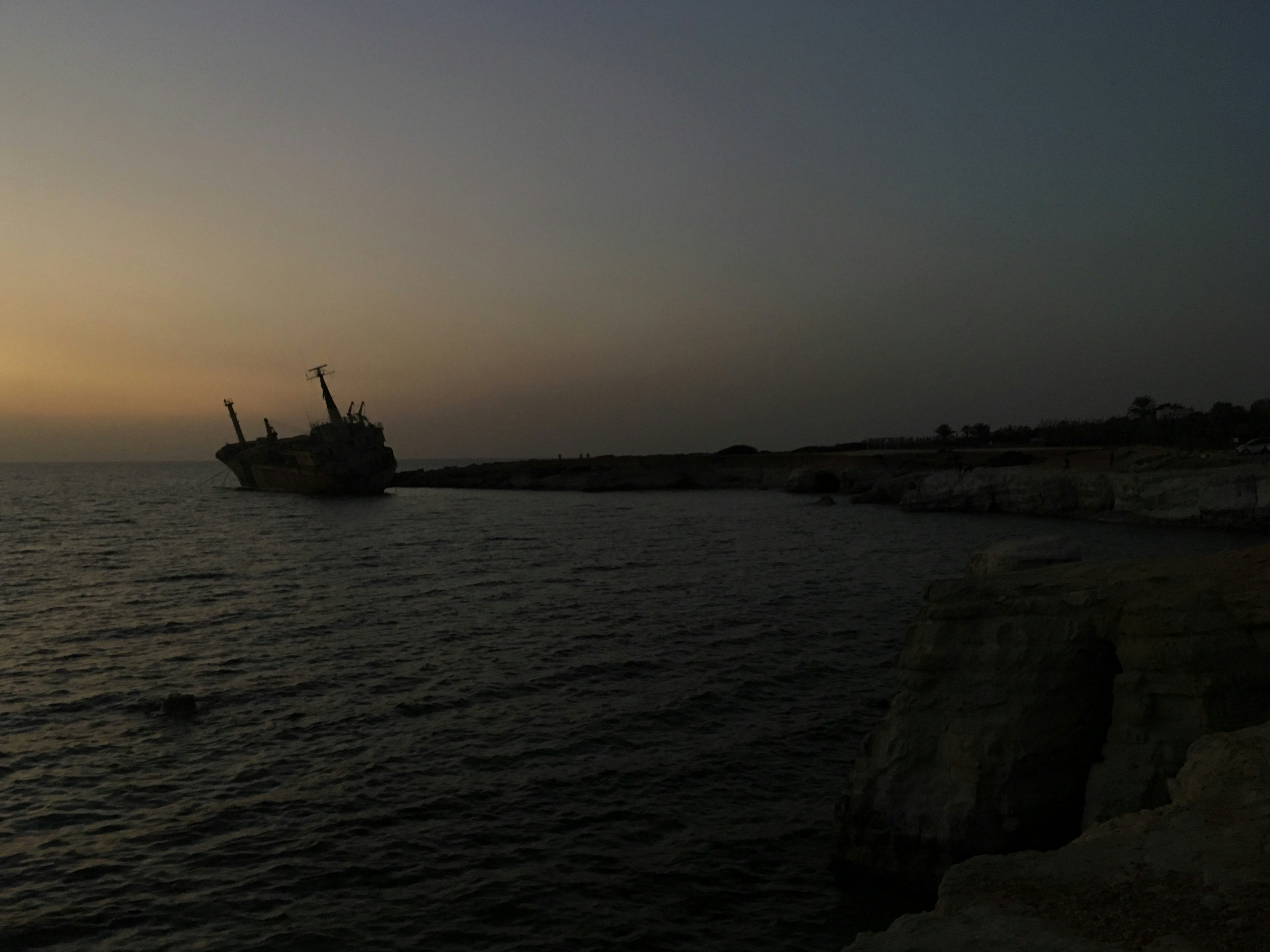 Twilight Wreck: A Silent Vessel Against the Dusk