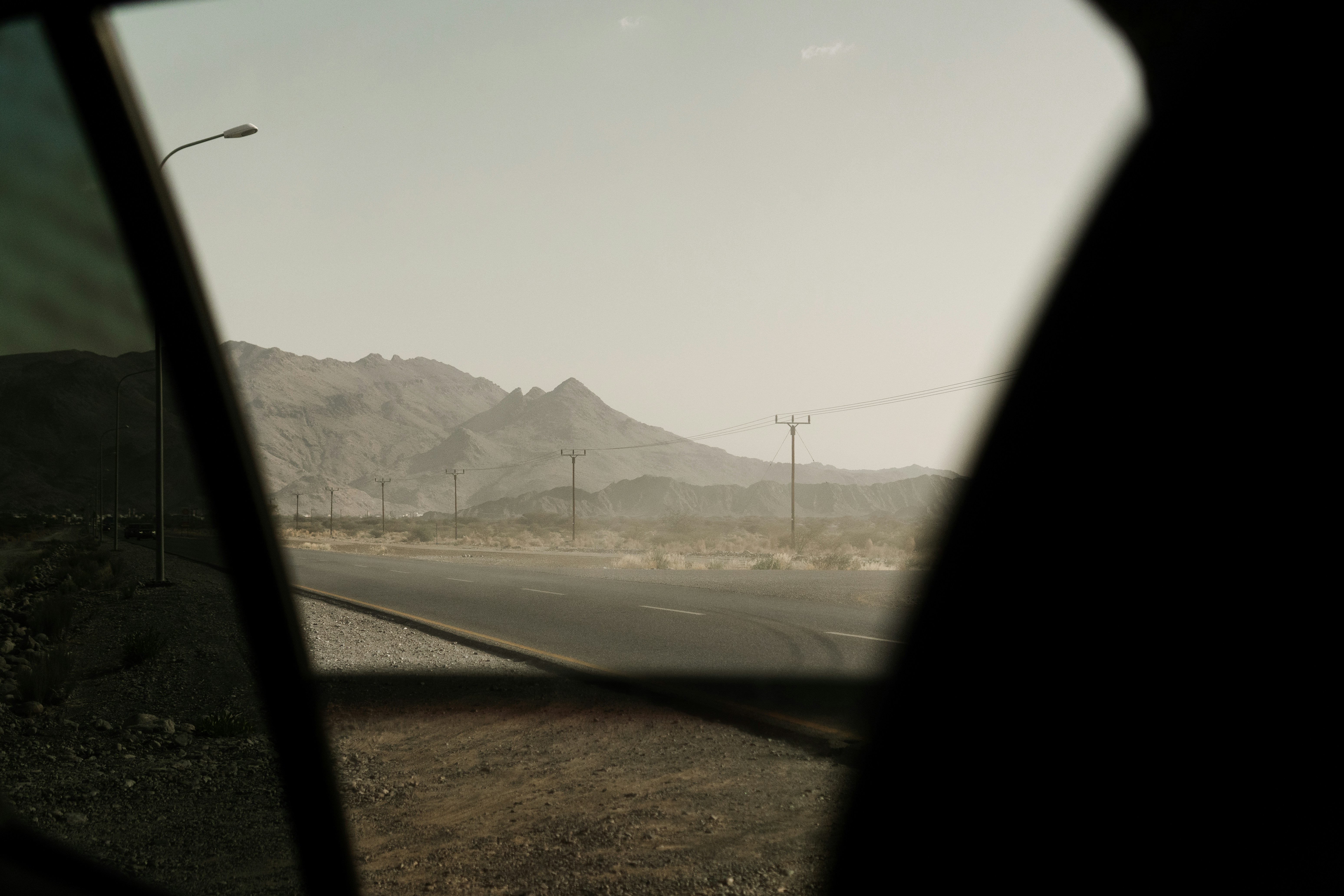Desert Road Framed by Vehicle Window