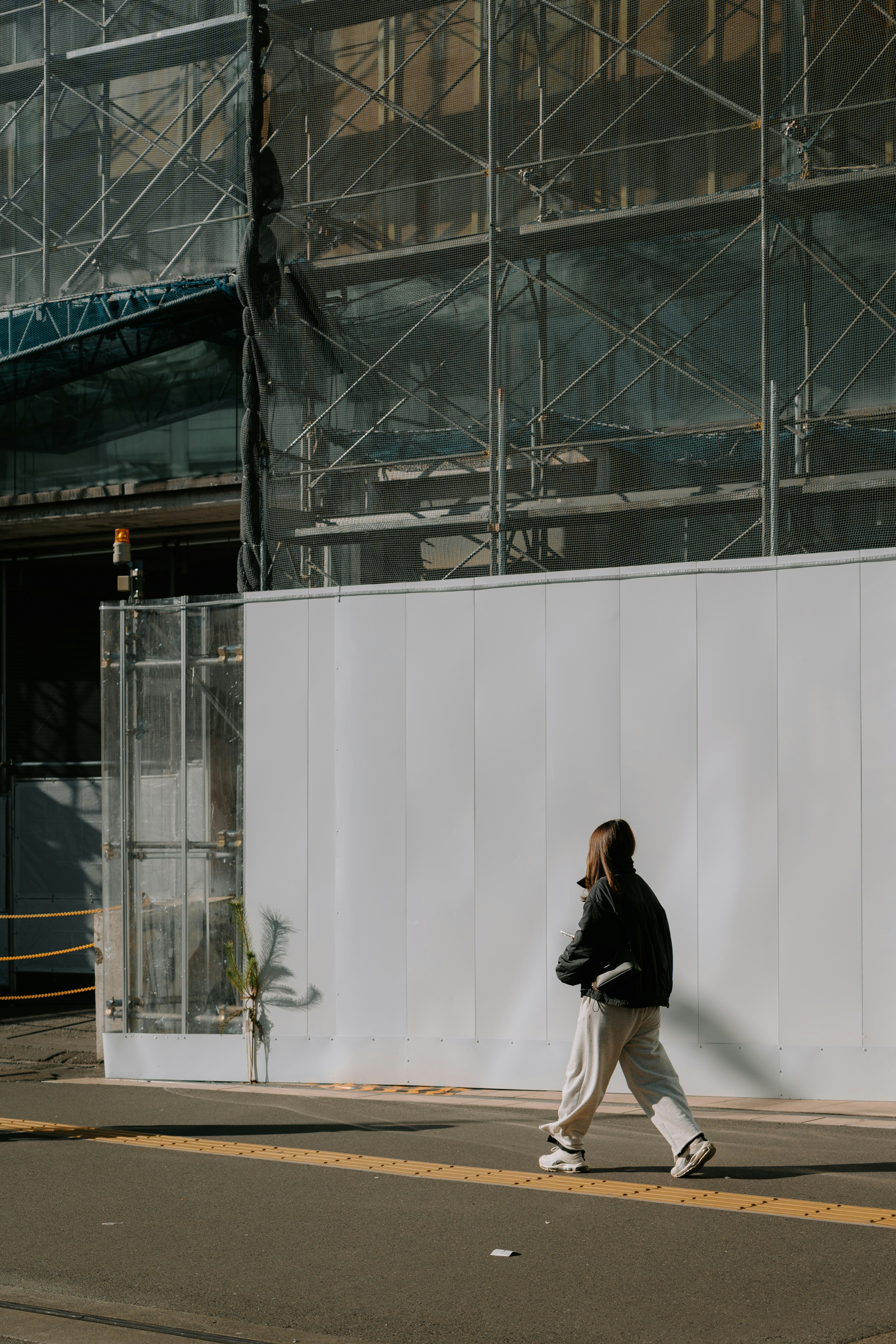 Construction Site Walker: Edge of a Modern Scaffold