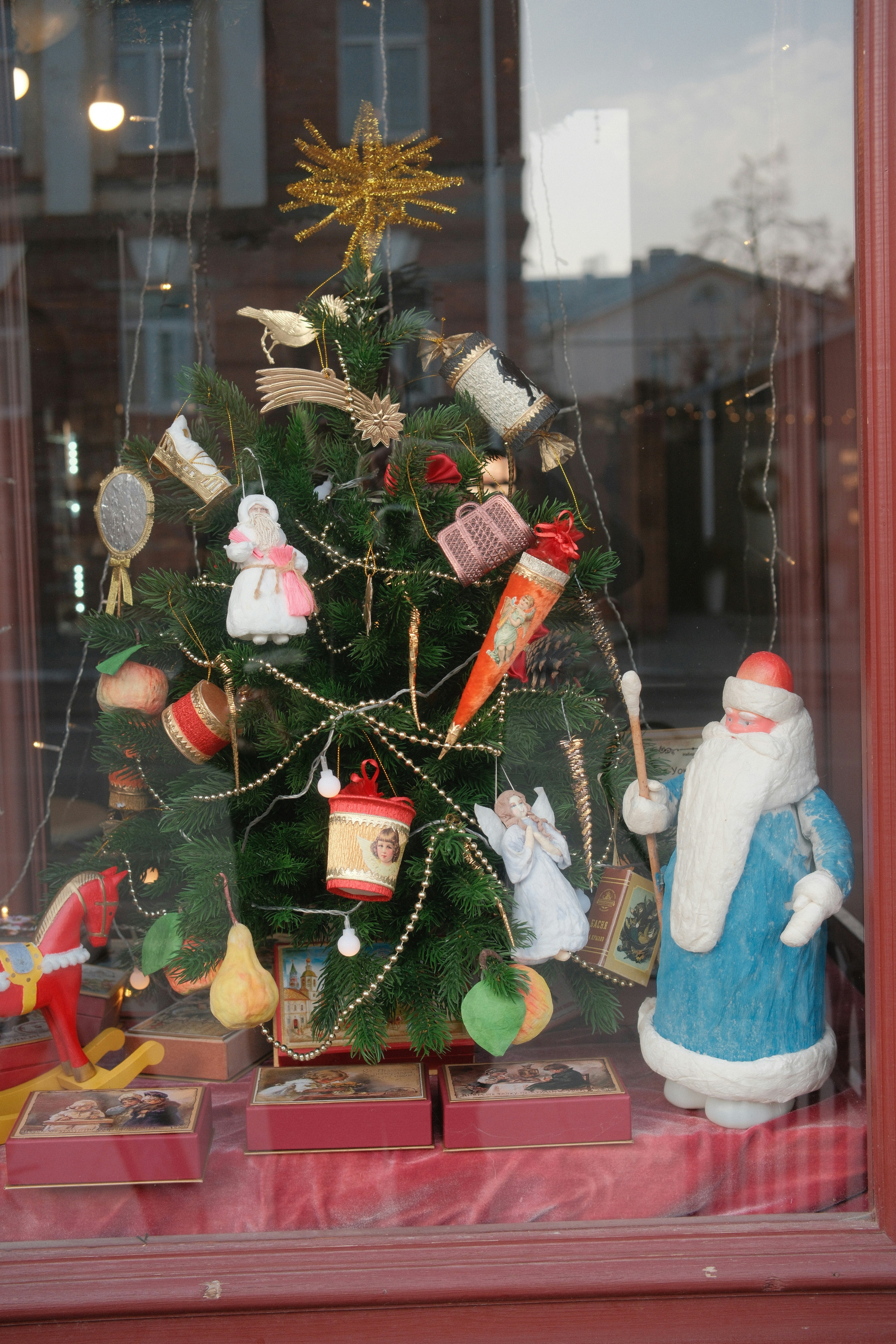 Shimmering Christmas Tree Adornments in a Storefront Window
