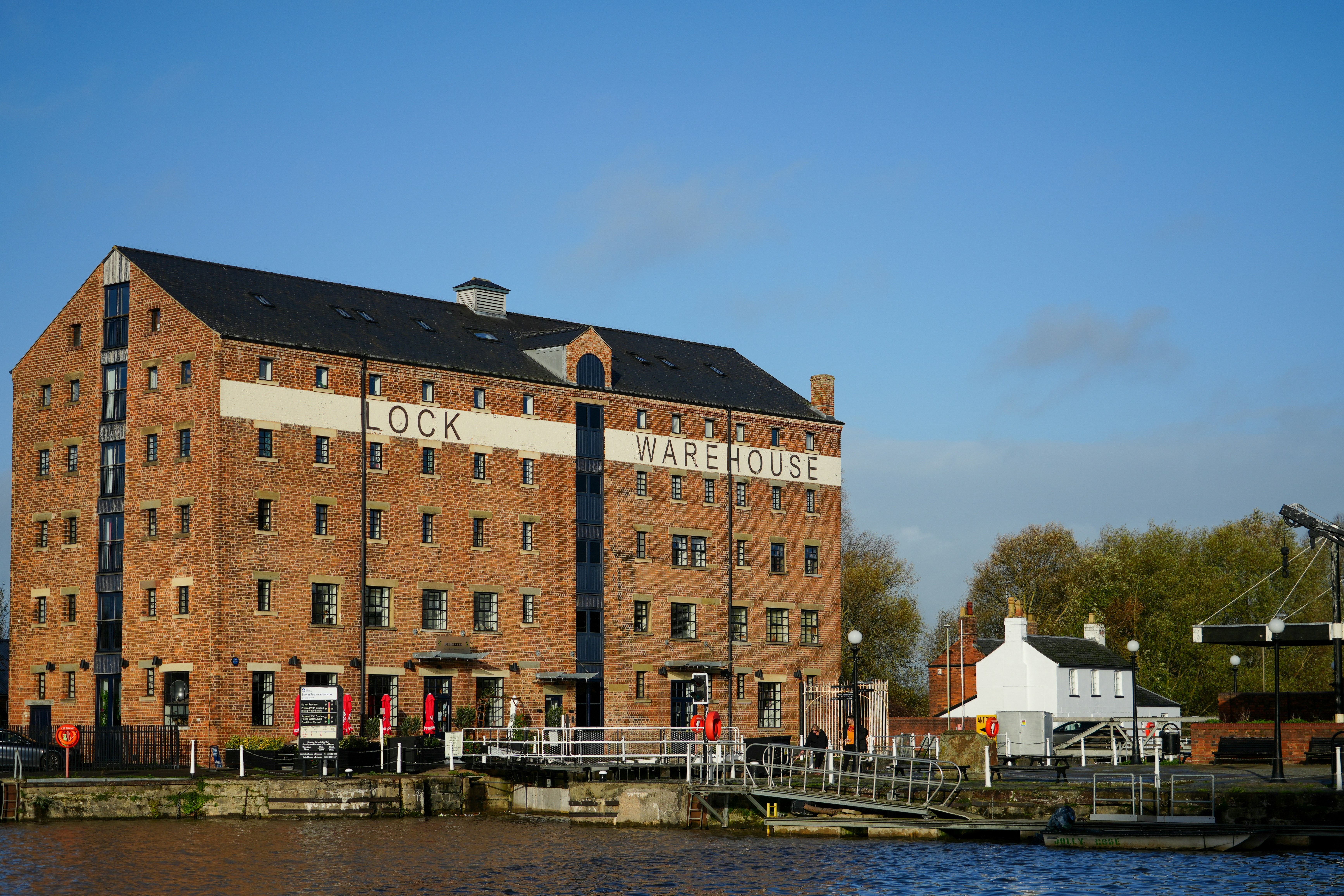 Dockside Brick Warehouse with Waterfront Activity