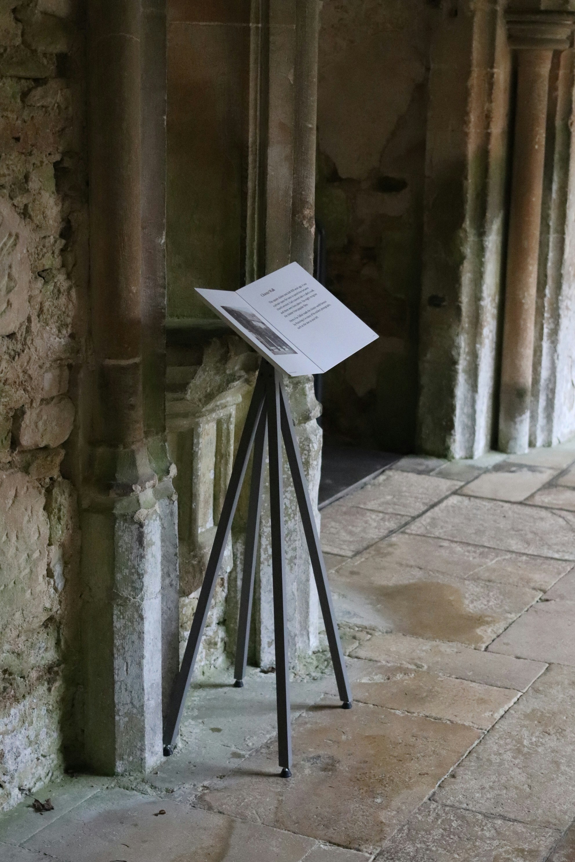 Guide Stand in Stone Corridor