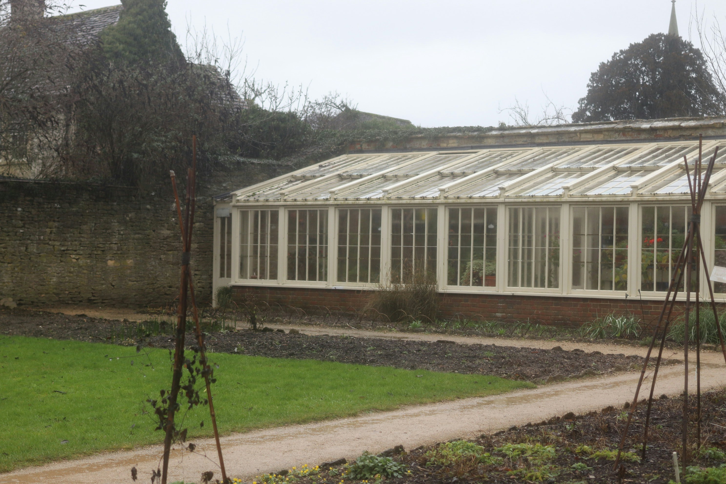 Glasshouse in a Quiet Garden Corridor