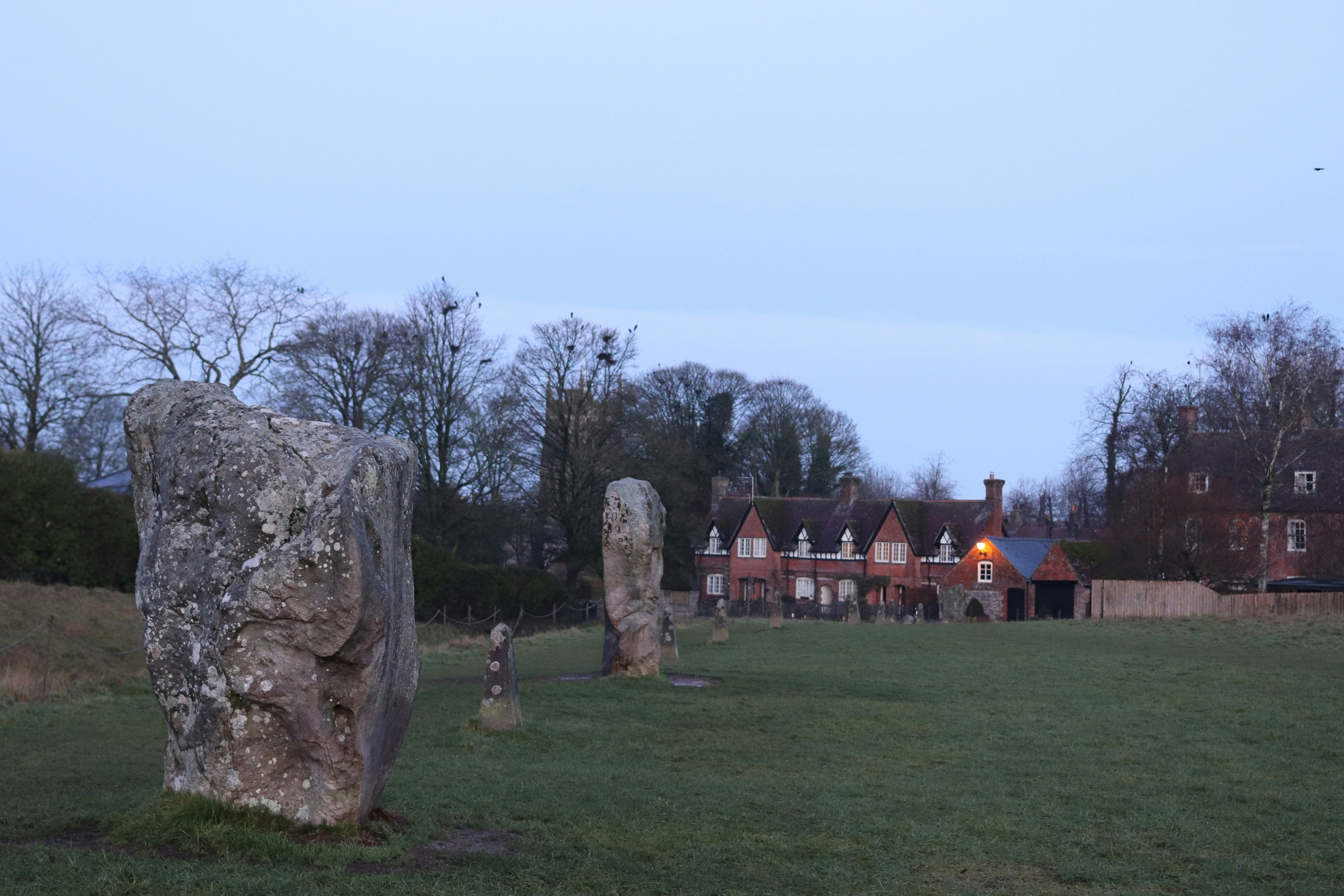 Stone Sentinels Overlook a Quiet Suburban Green