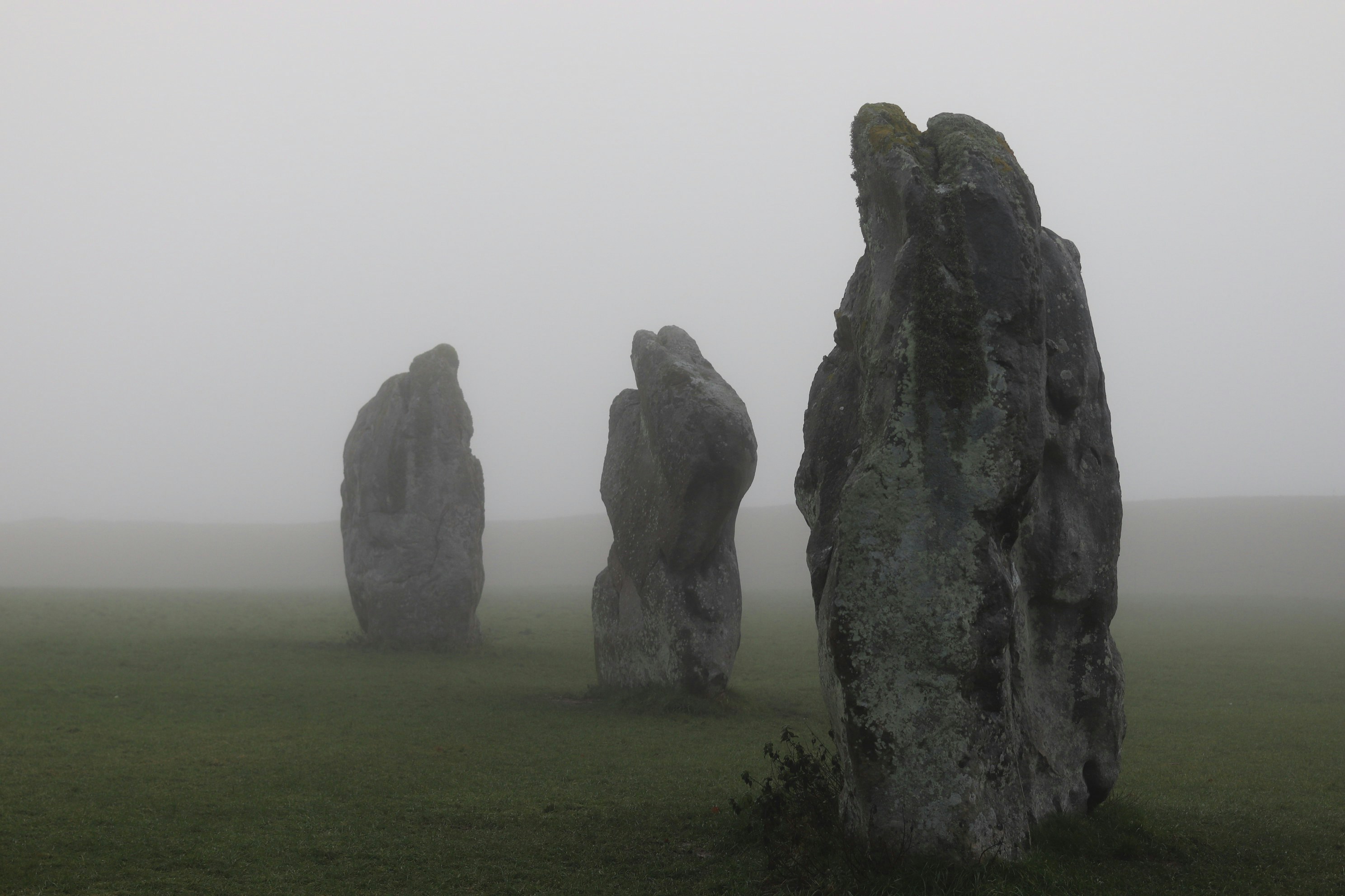 Misty Monoliths: Weathered Stones Stand in Quiet Fog