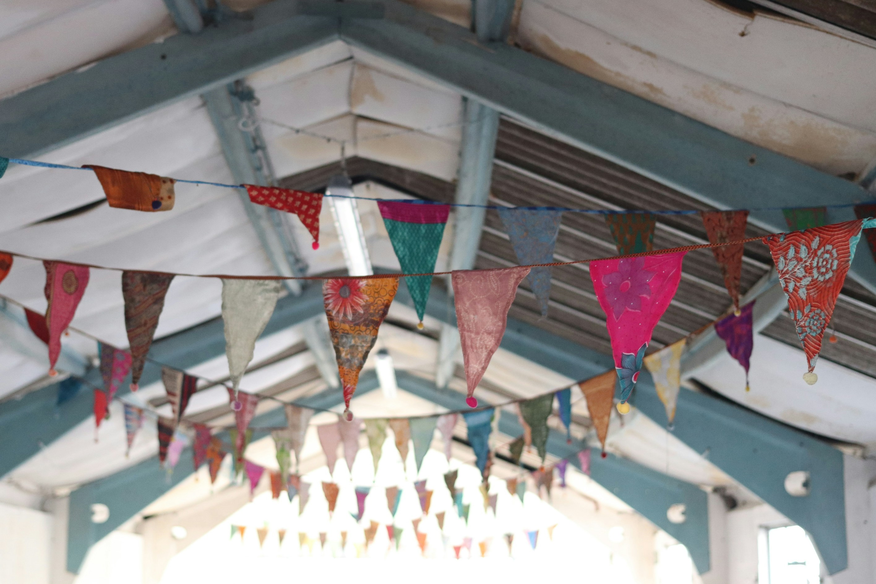 Colorful Bunting Under a Painted Roof Truss