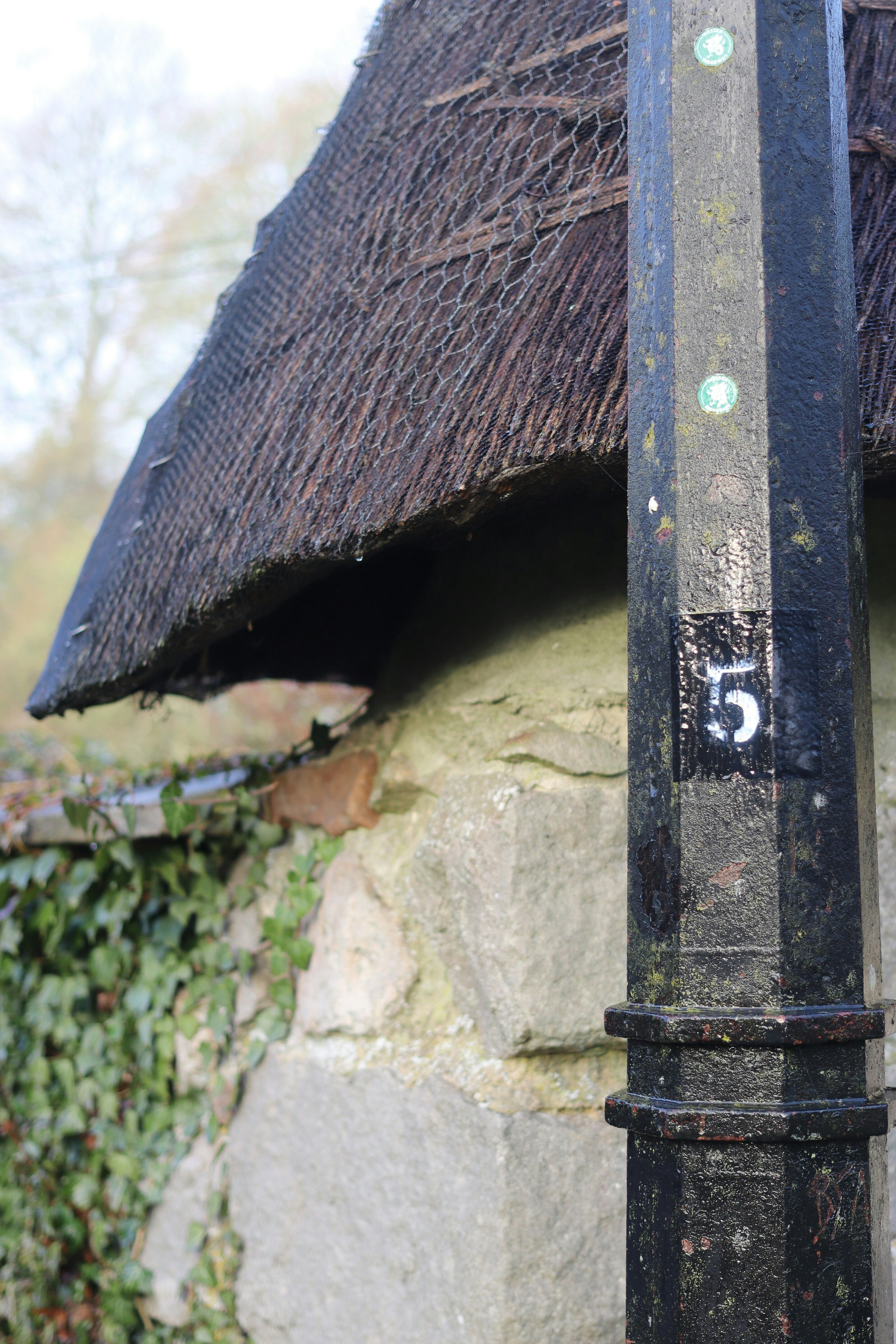Numbered Post with Weathered Roof Edge