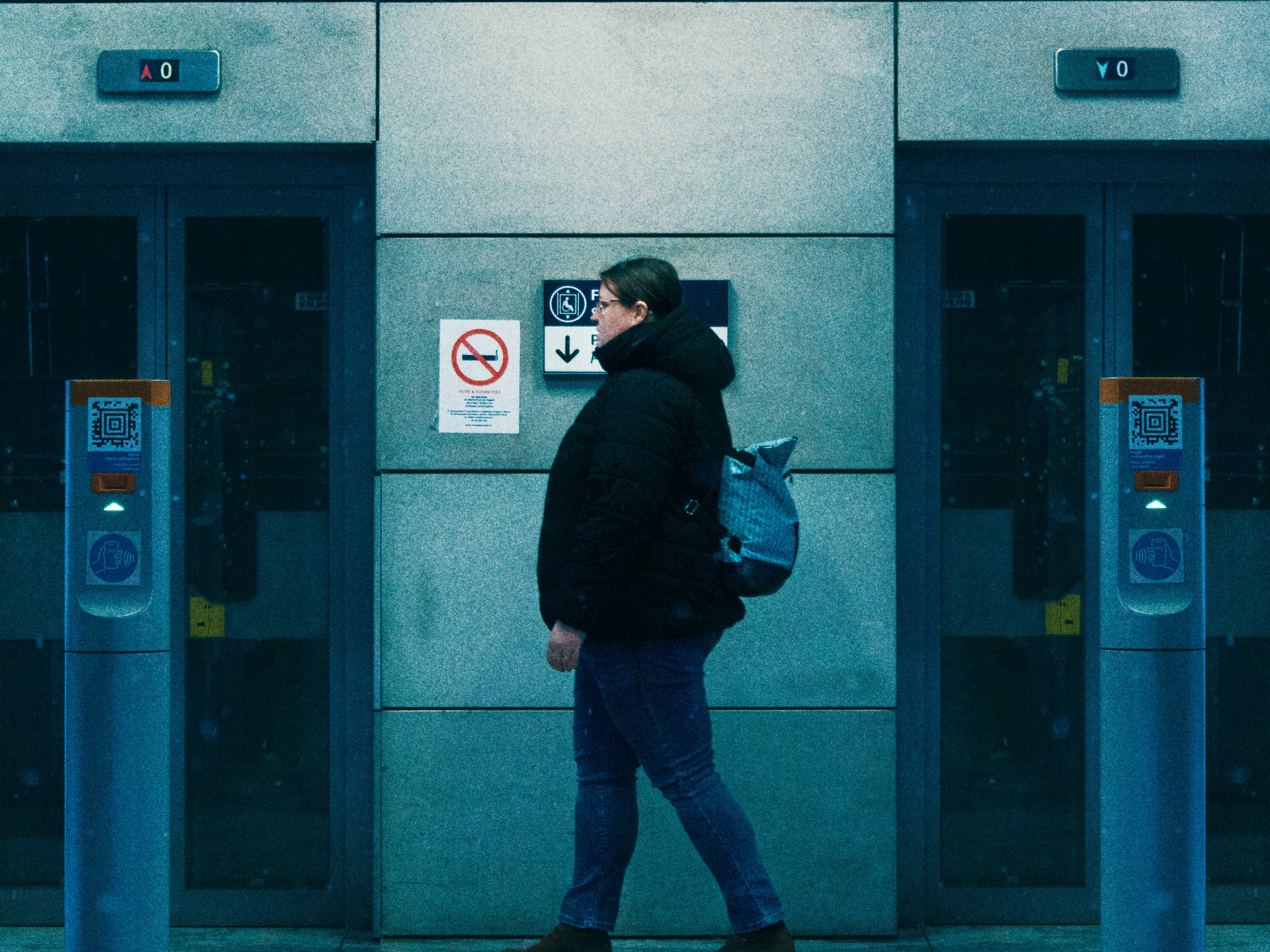 Urban commuter in cobalt evening at the station