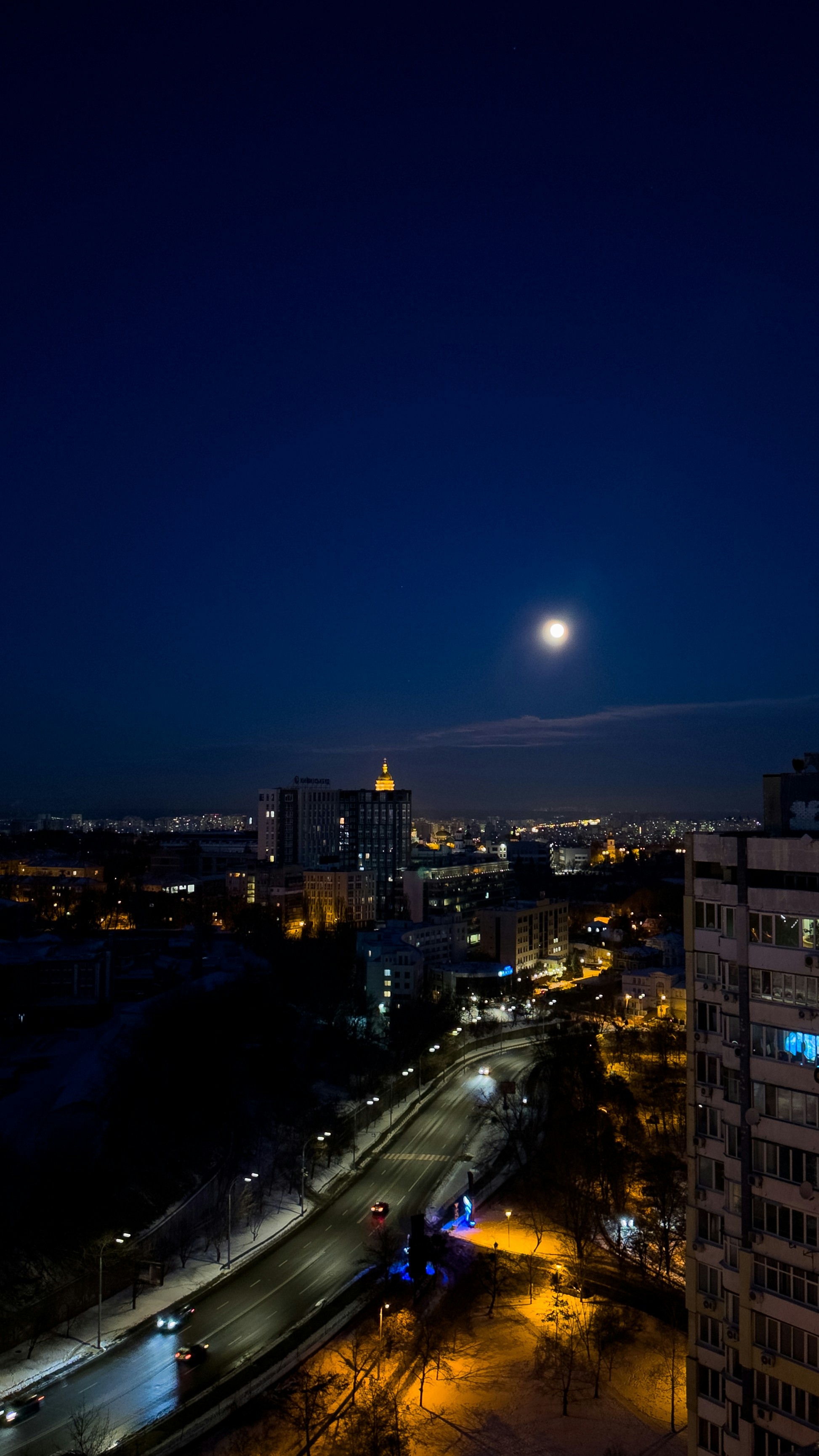 Moonlit Skyline Over a Quiet City Boulevard