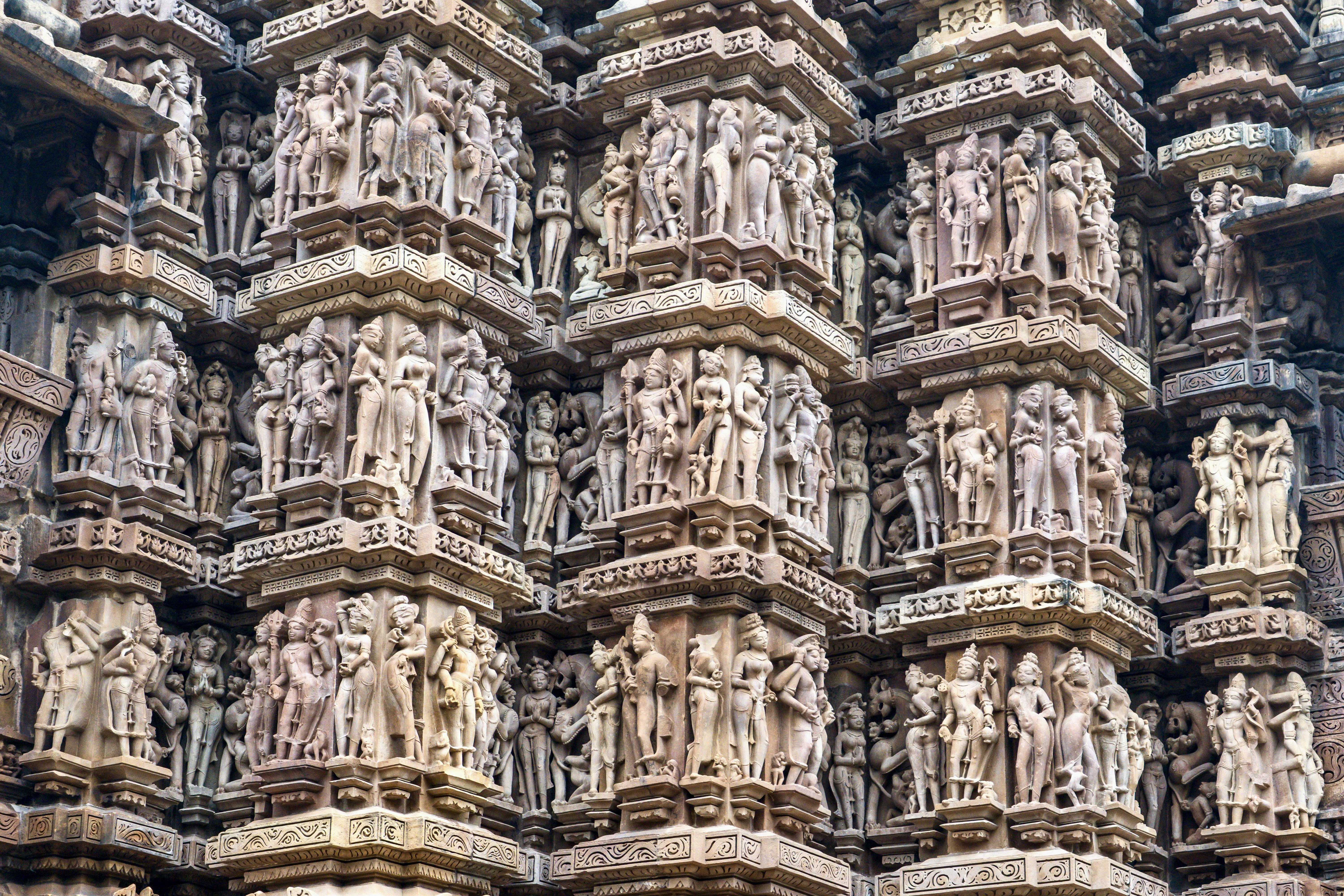 Carved chorus: a dense field of shrine figures marching across stone façades