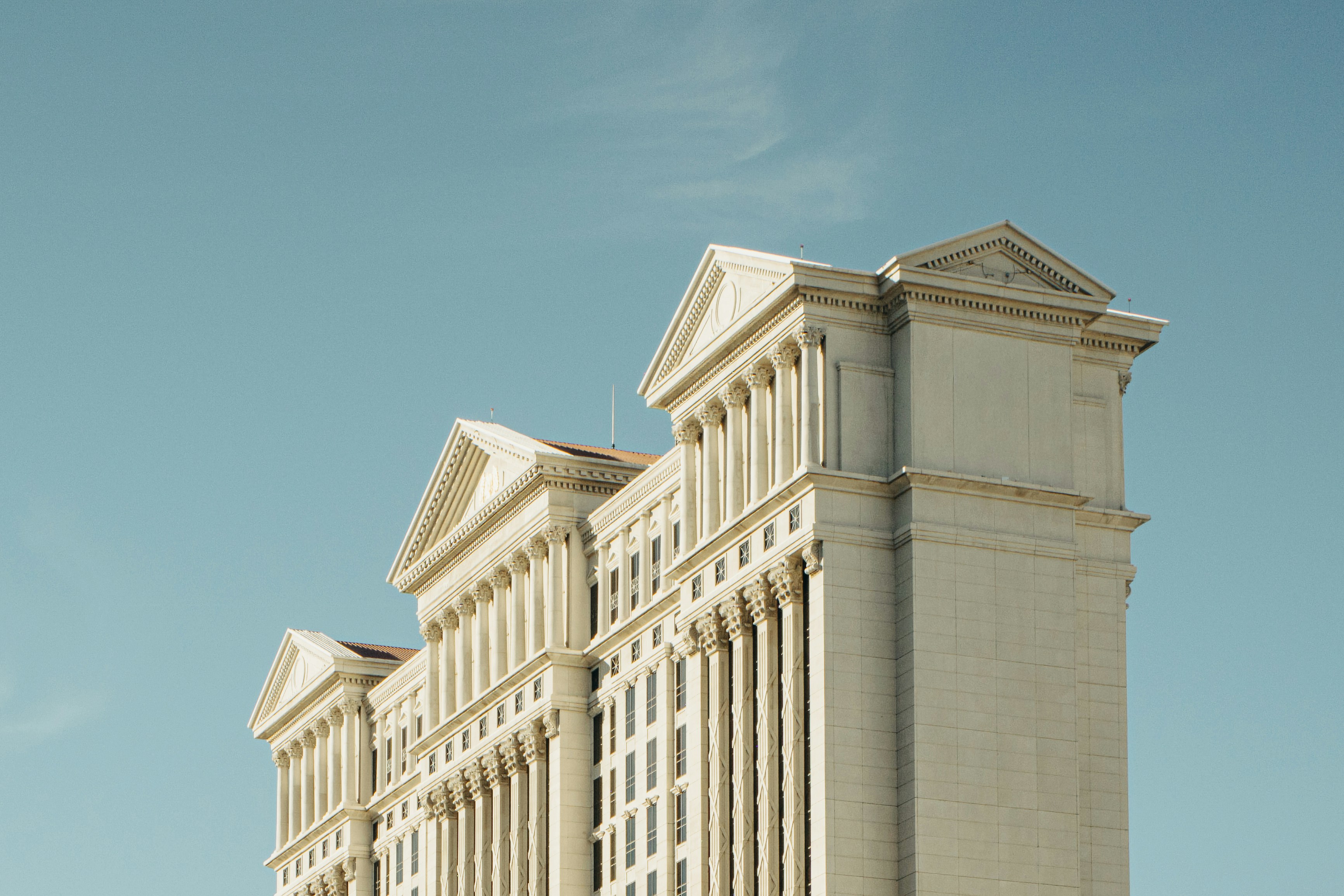 Stone Lattice Rising: A Corner of Classical Grandeur Against a Clear Sky