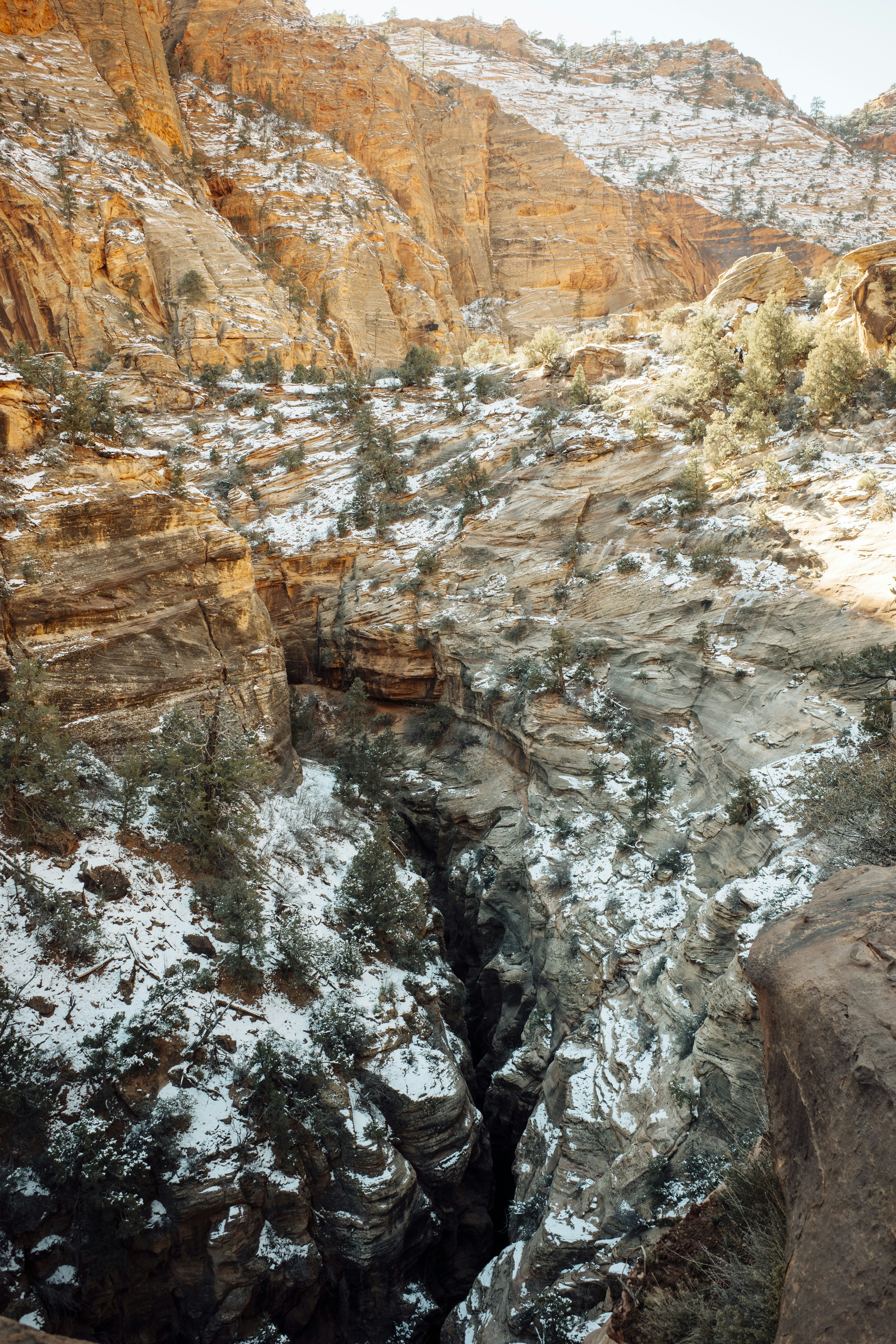 Sunlit Canyon Snow: A Rugged Rift Carved in Stone