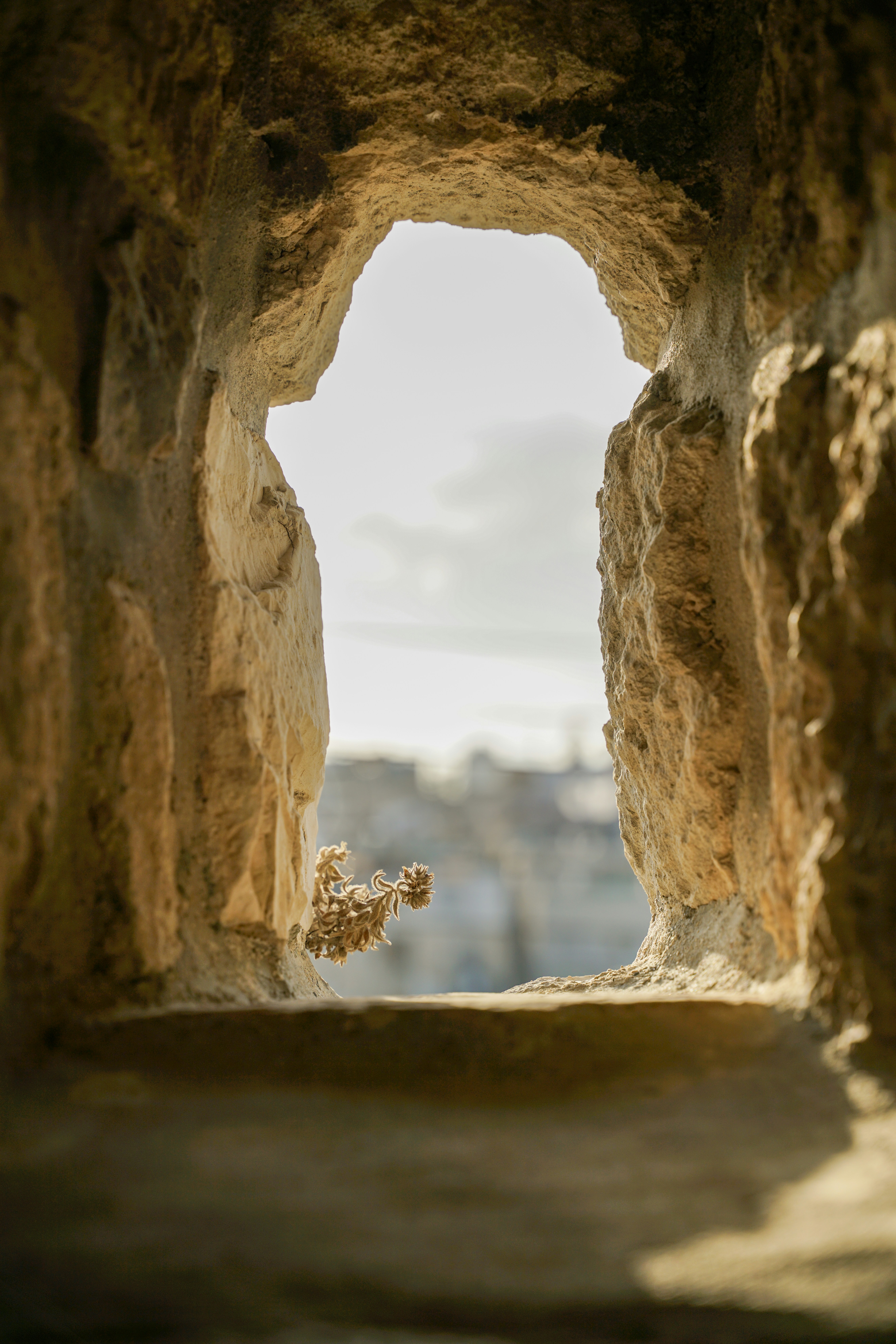 Light Through the Ruins: A Quiet Beam Framed by Stone