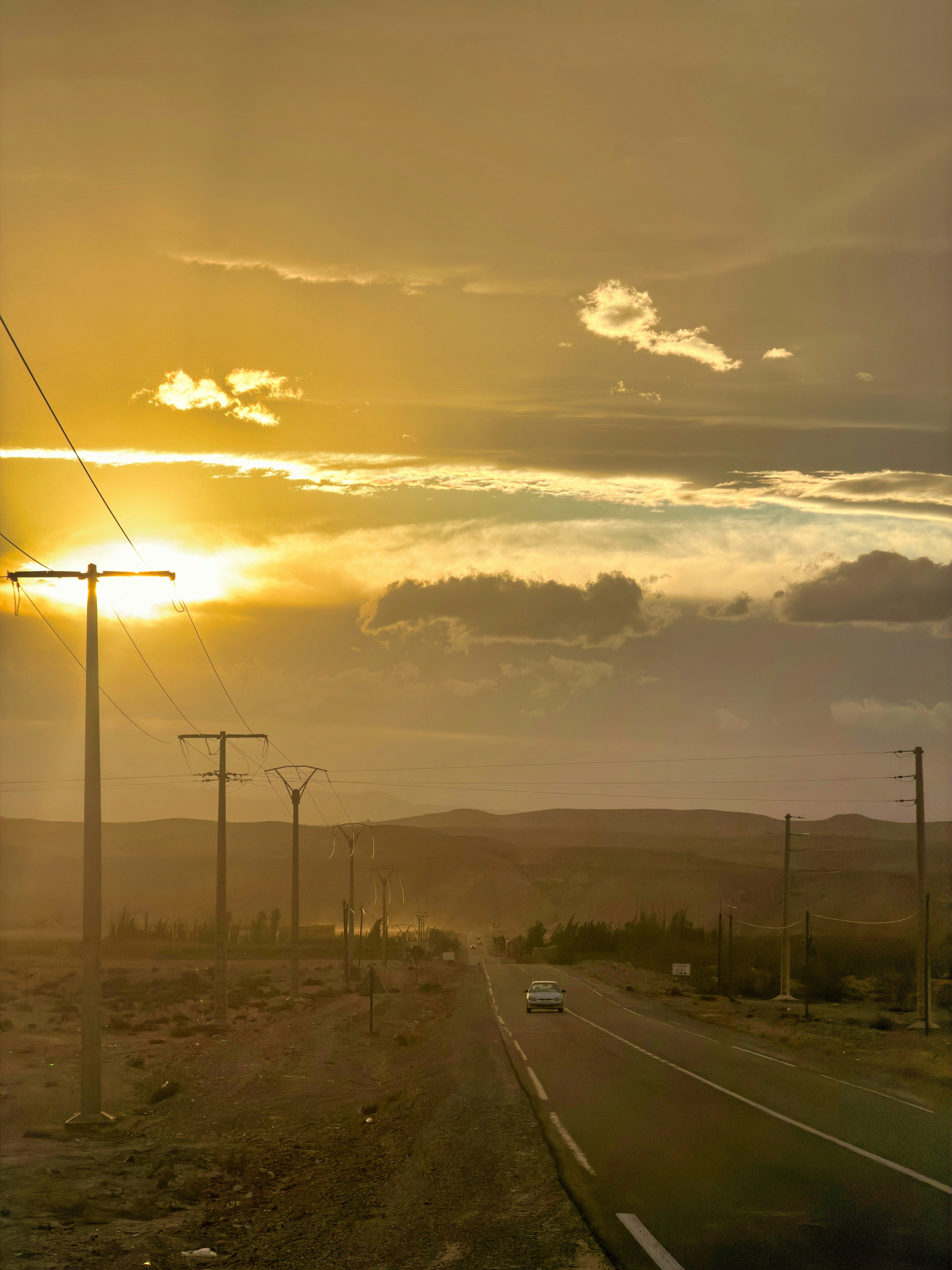 Dusty Horizon: A Desert Highway at Sunset