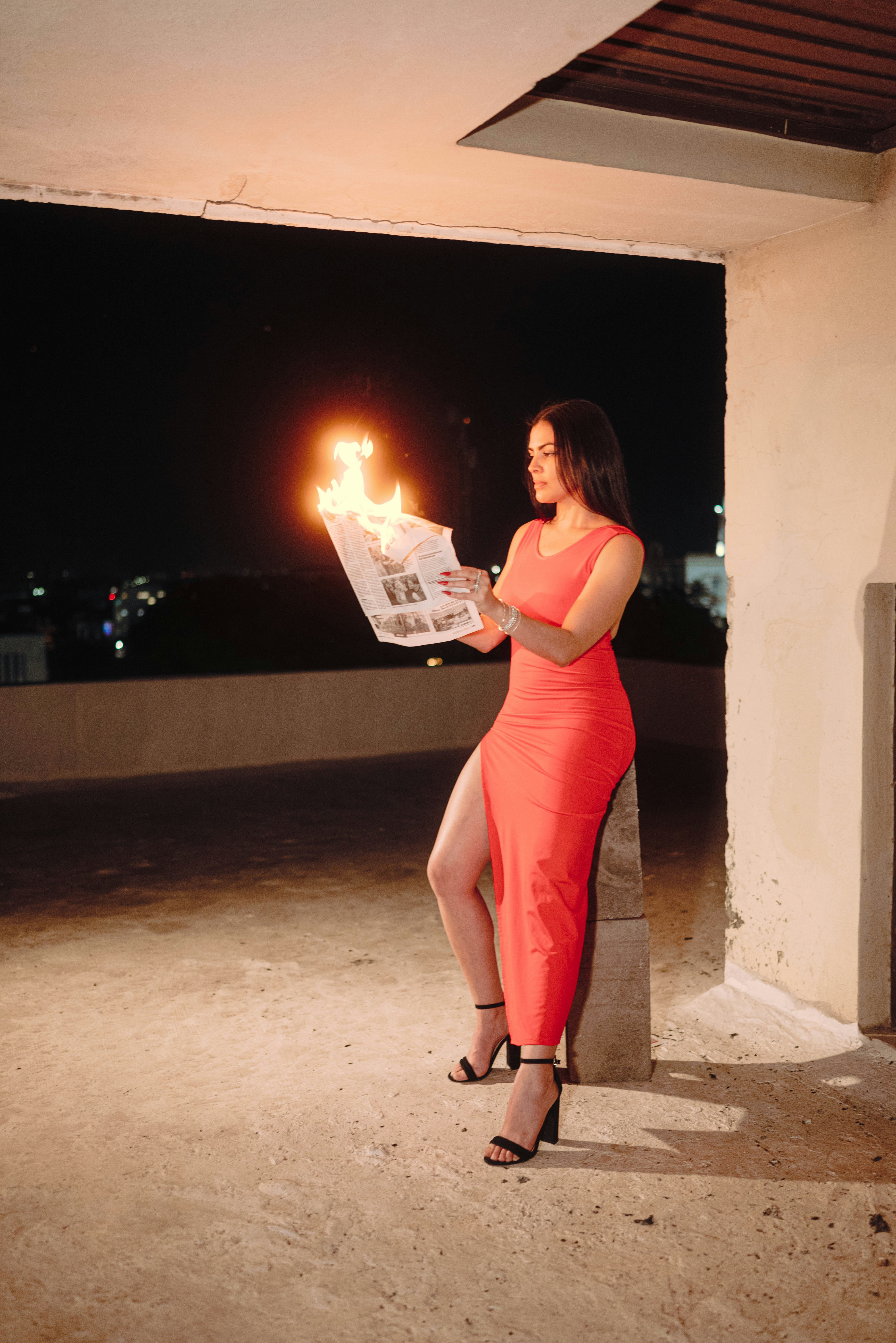 Flame-lit Red: Night Vogue with Newspaper Charms