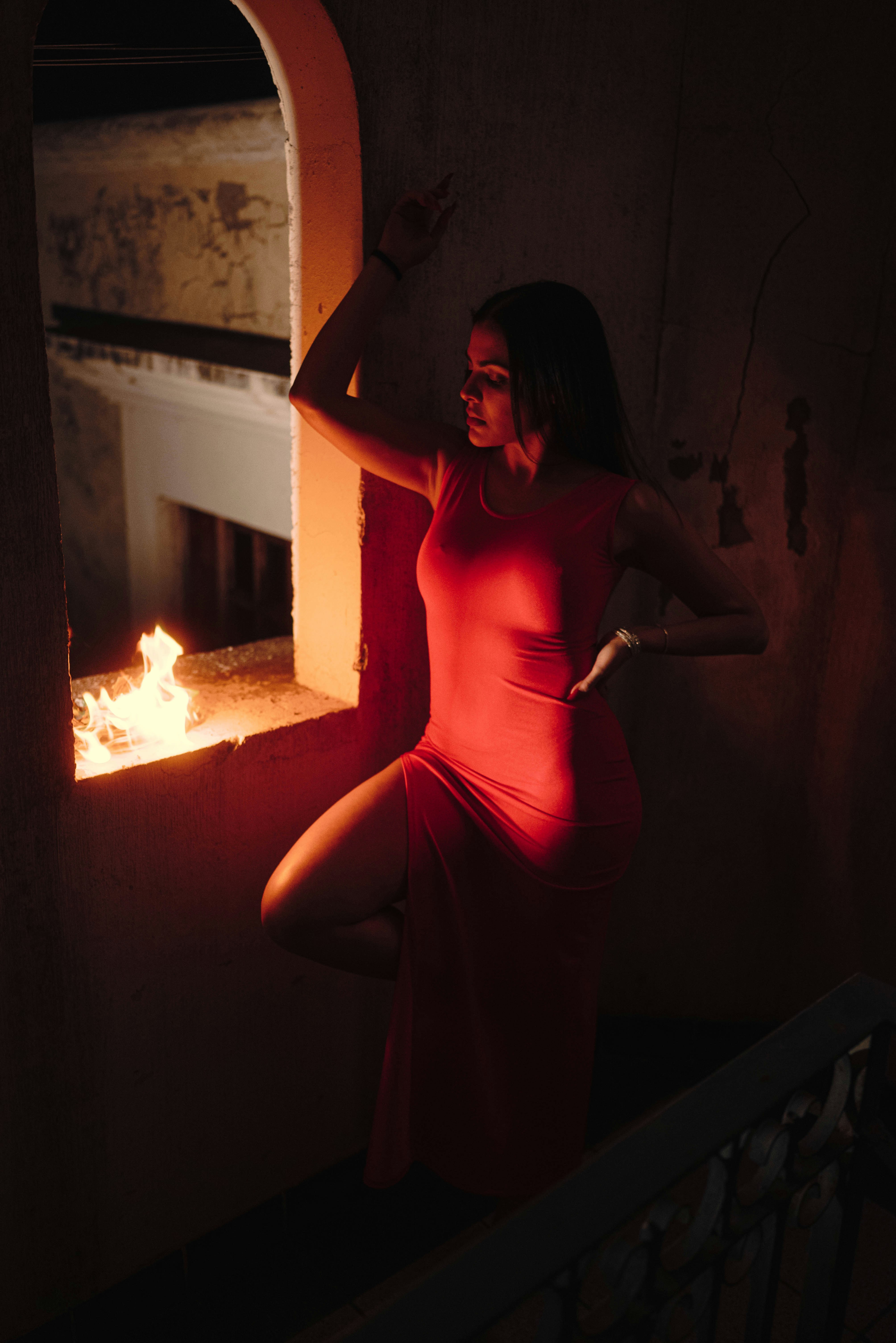 Crimson Silhouette by the Fire