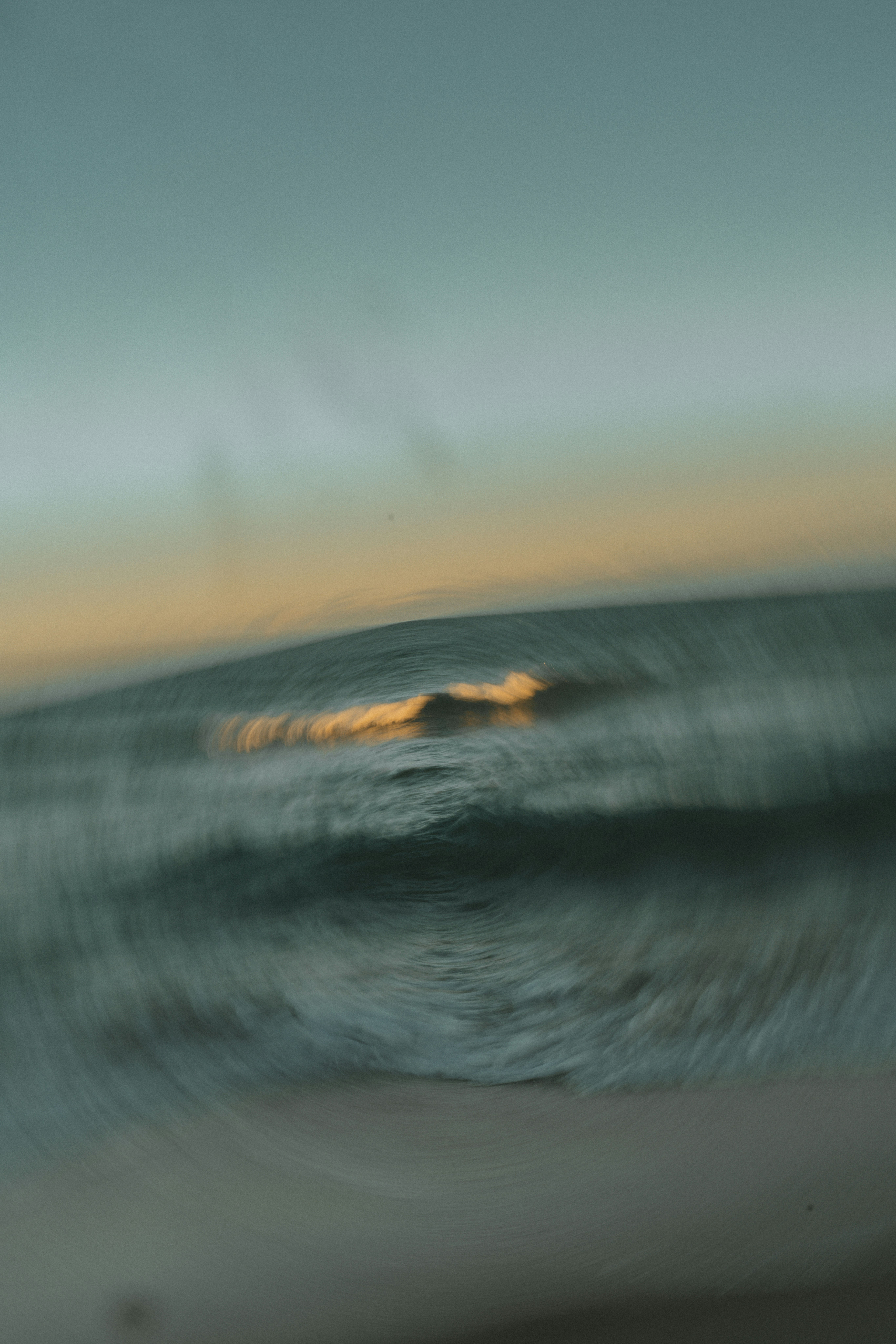 Circular Wave: Blurred Horizon in a Sunset Swirl