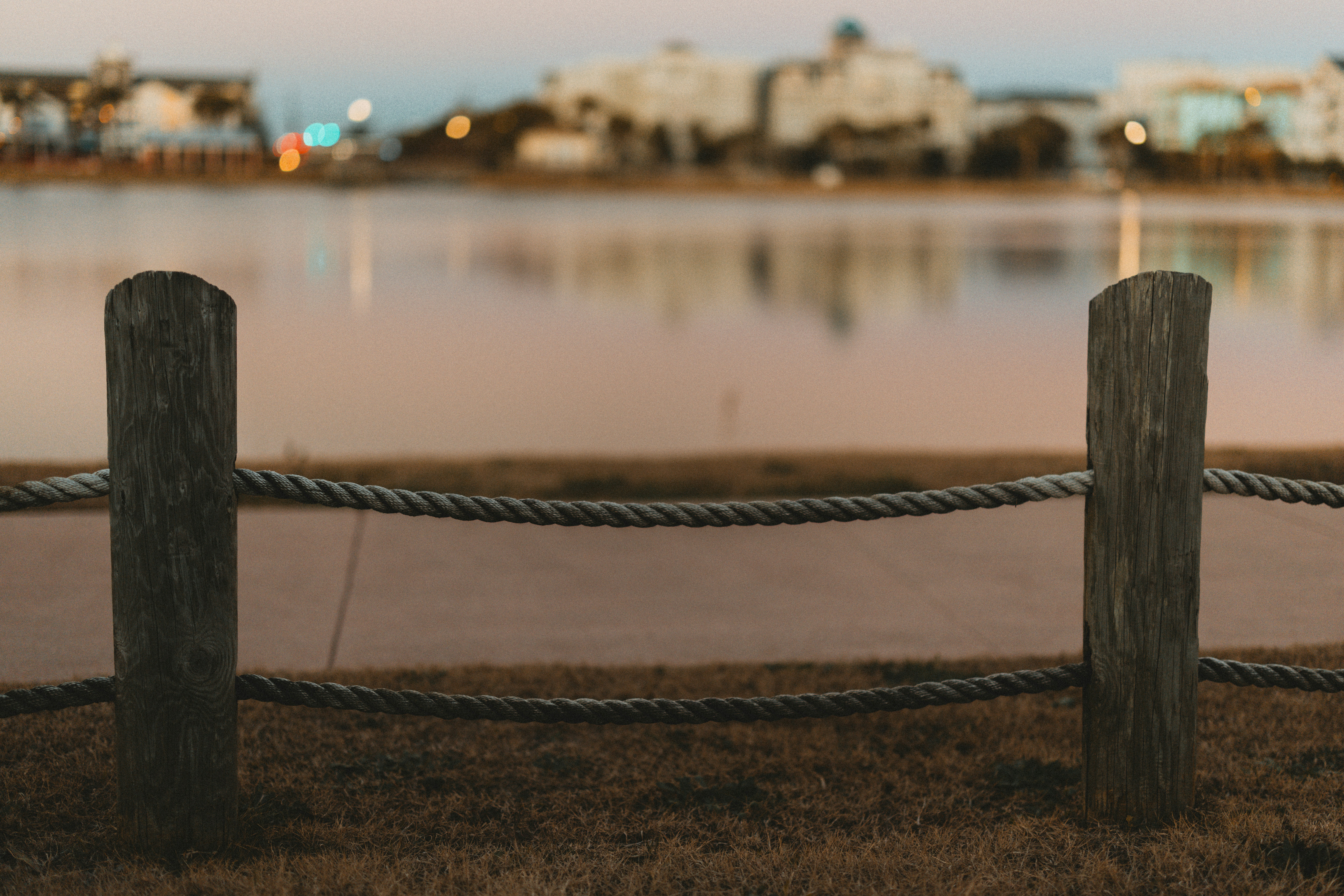 Rope Barrier by the Shore at Dusk