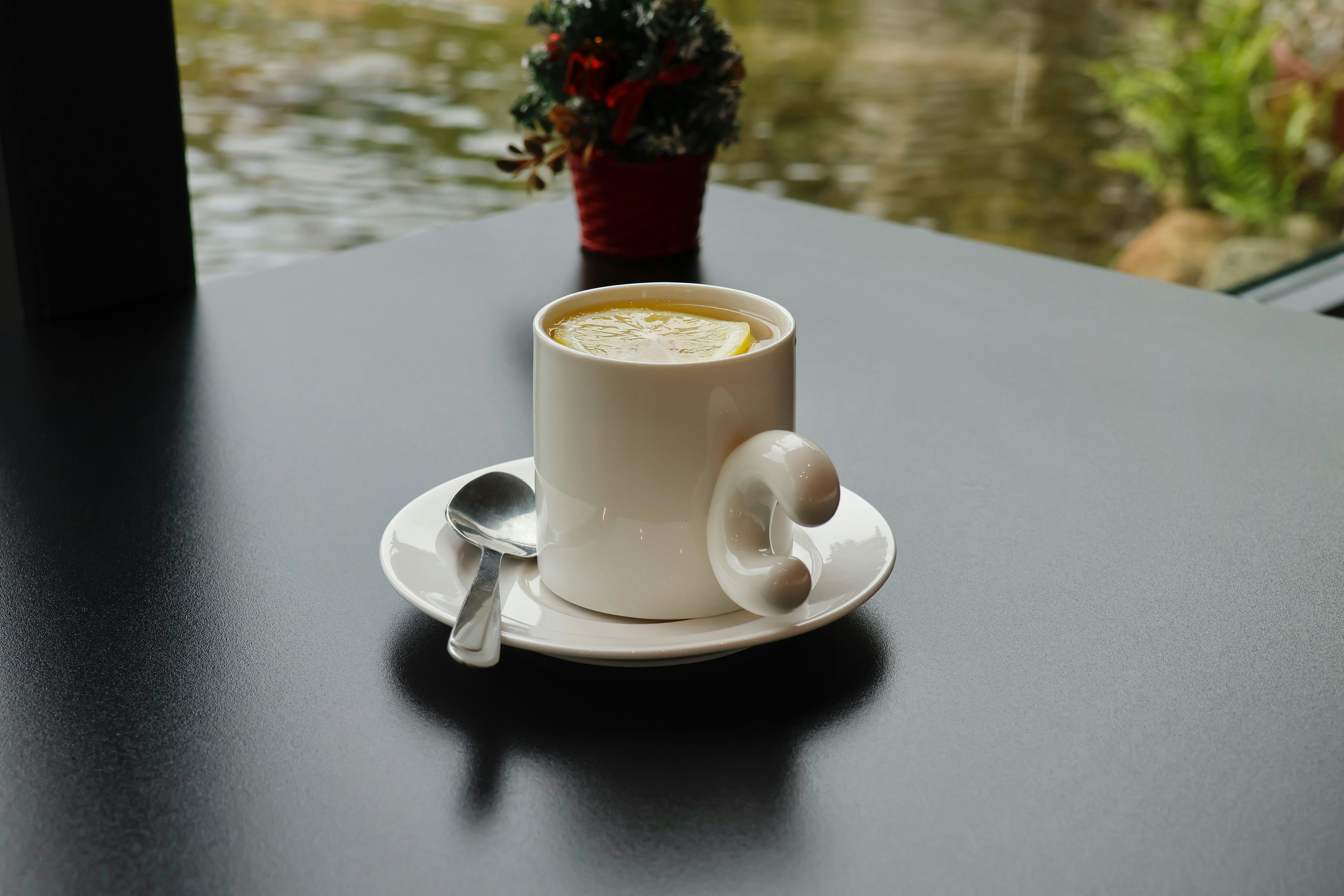 Quiet Café steam: a cup of coffee on a sunlit table